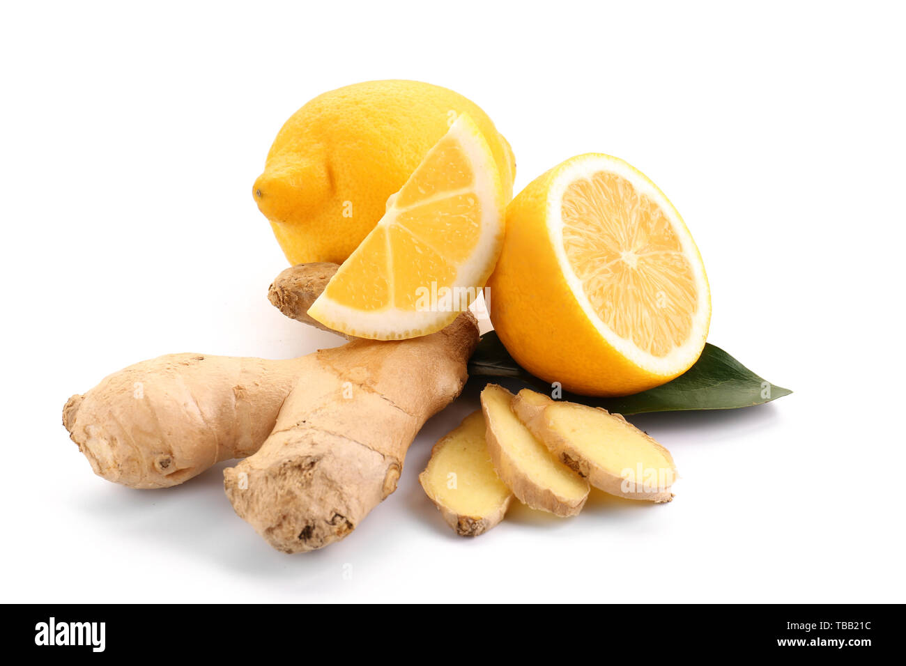 Fresh lemon with ginger on white background Stock Photo - Alamy