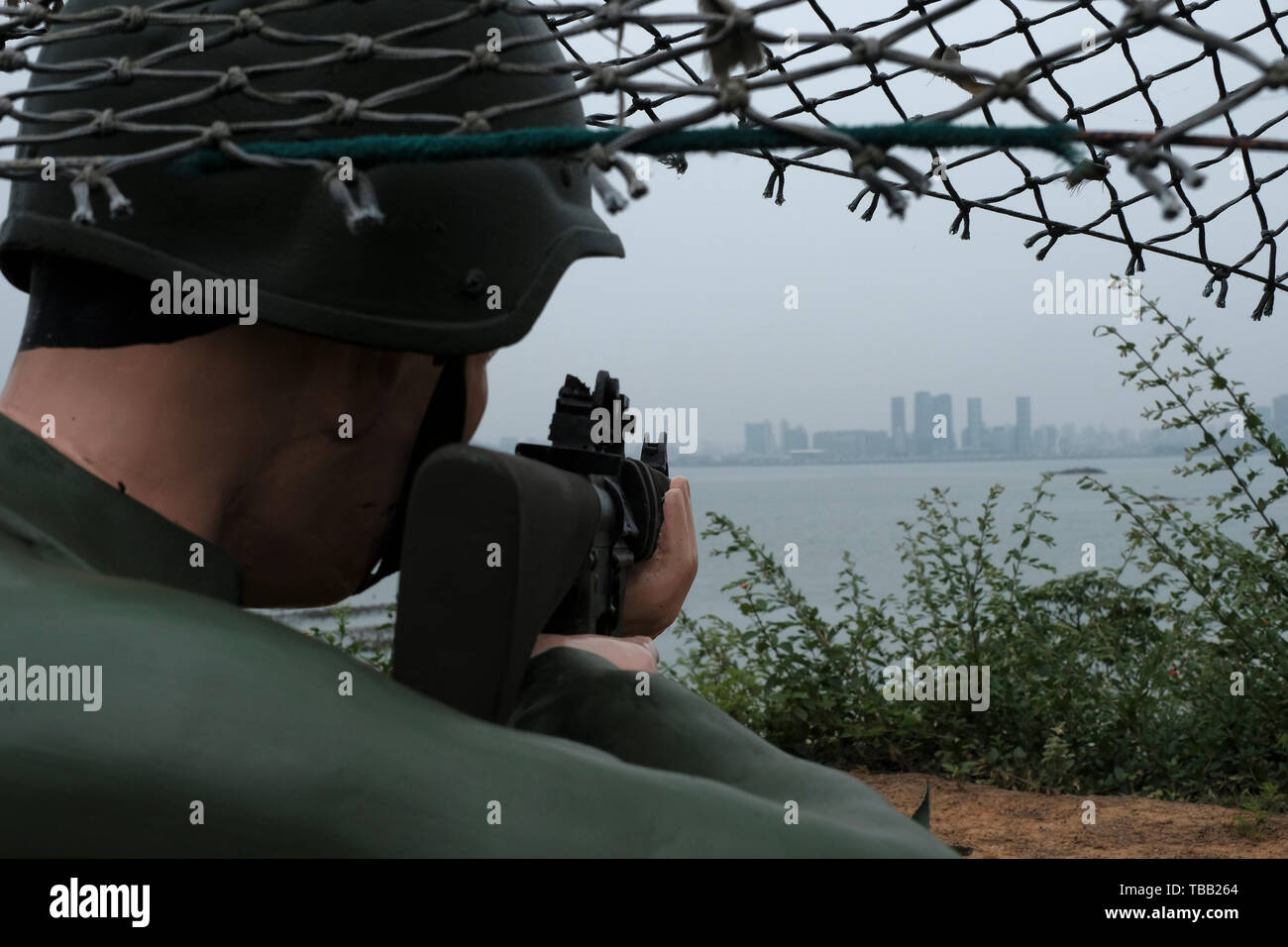 Life-sized mannequin illustrates soldier in combat position placed on ...