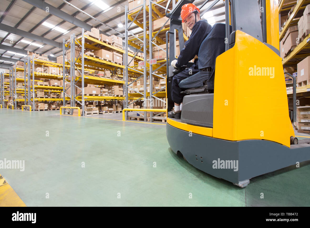 Logistics personnel load and unload cargo at the warehouse Stock Photo ...