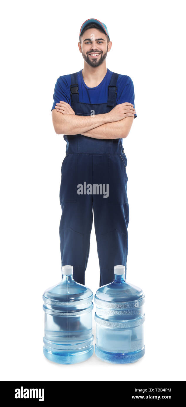 Delivery man with bottles of water on white background Stock Photo - Alamy
