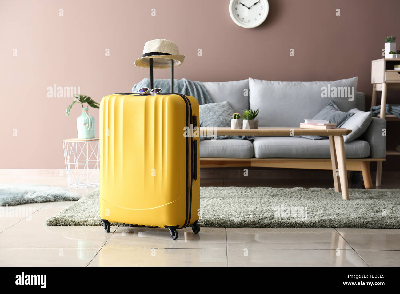 Packed suitcase in room. Travel concept Stock Photo - Alamy