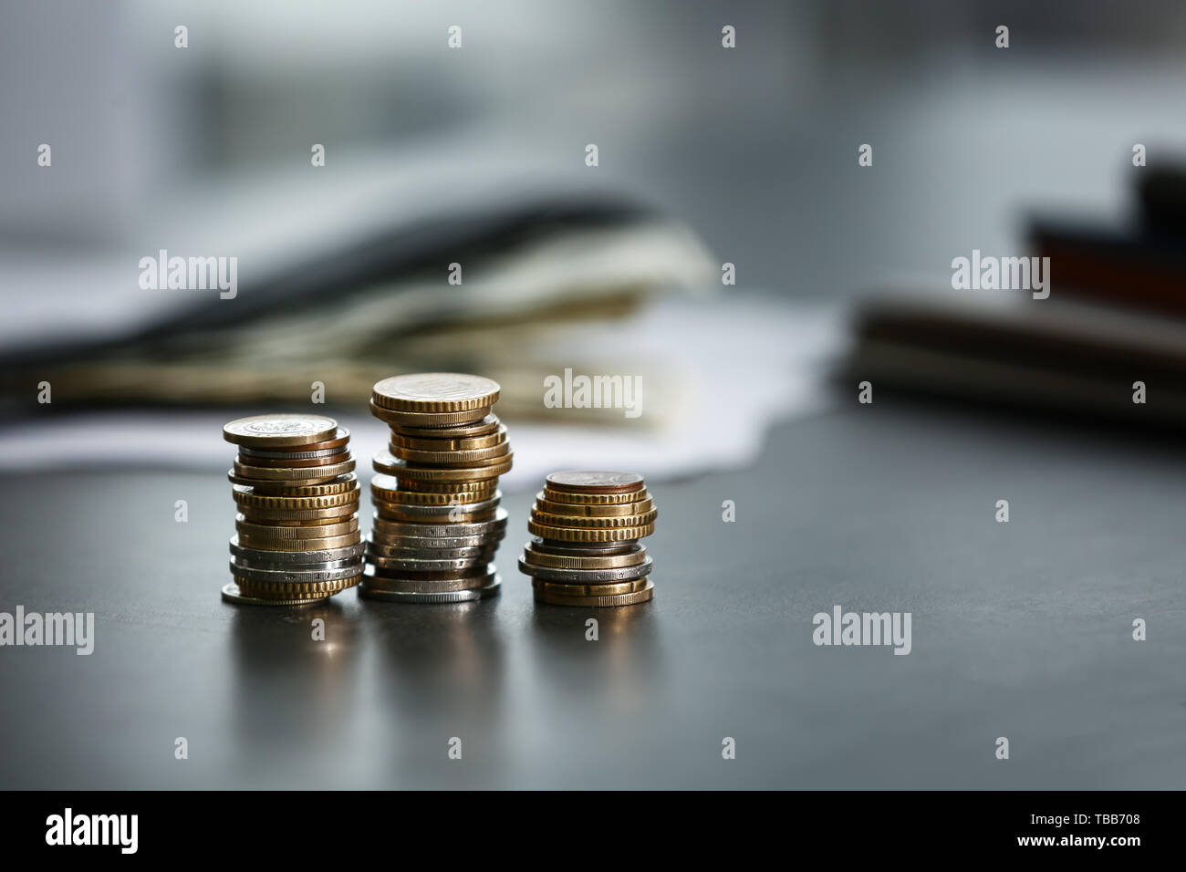 Stacked coins on table. Concept of planning budget Stock Photo - Alamy