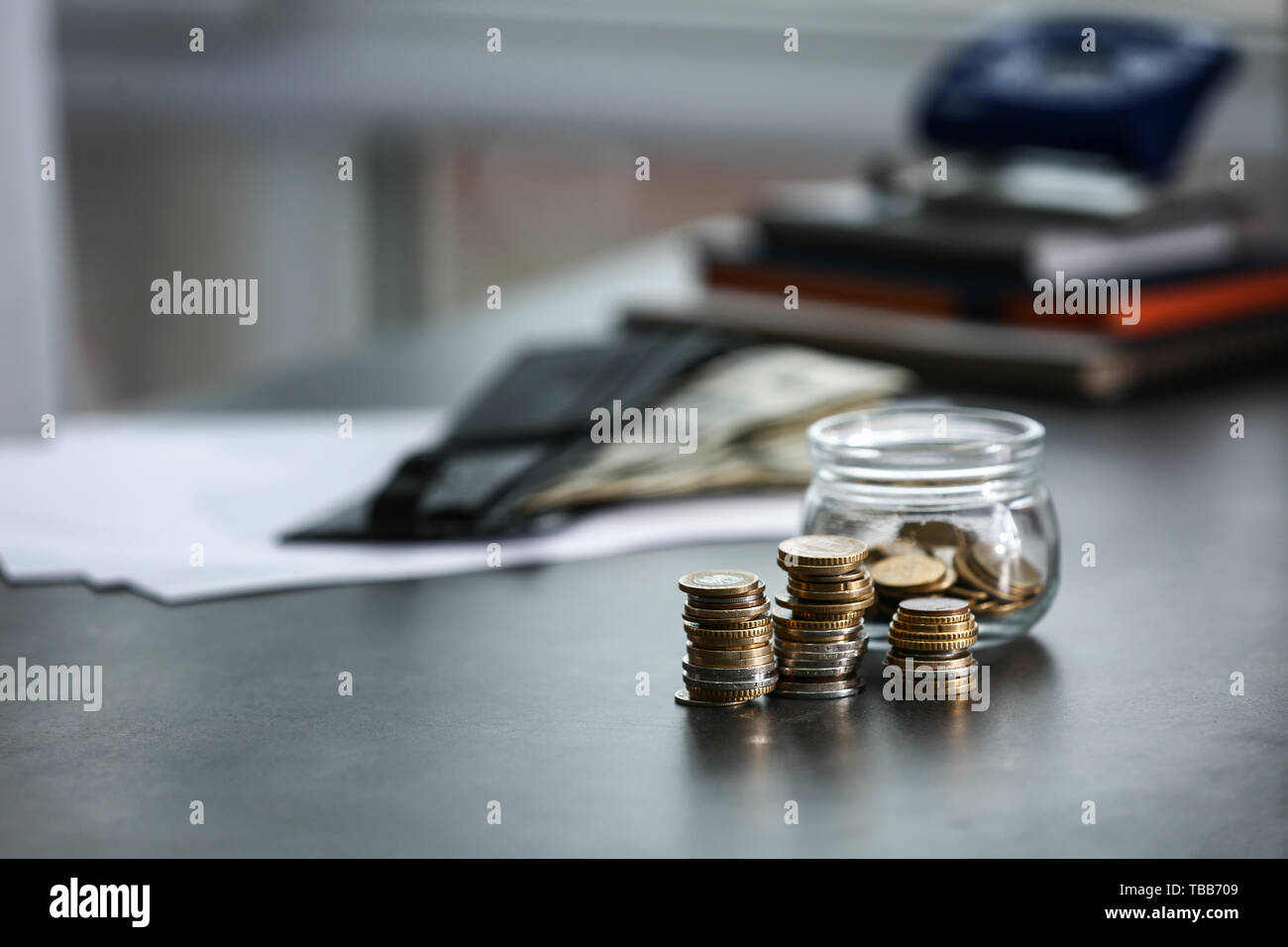 Stacked coins on table. Concept of planning budget Stock Photo - Alamy