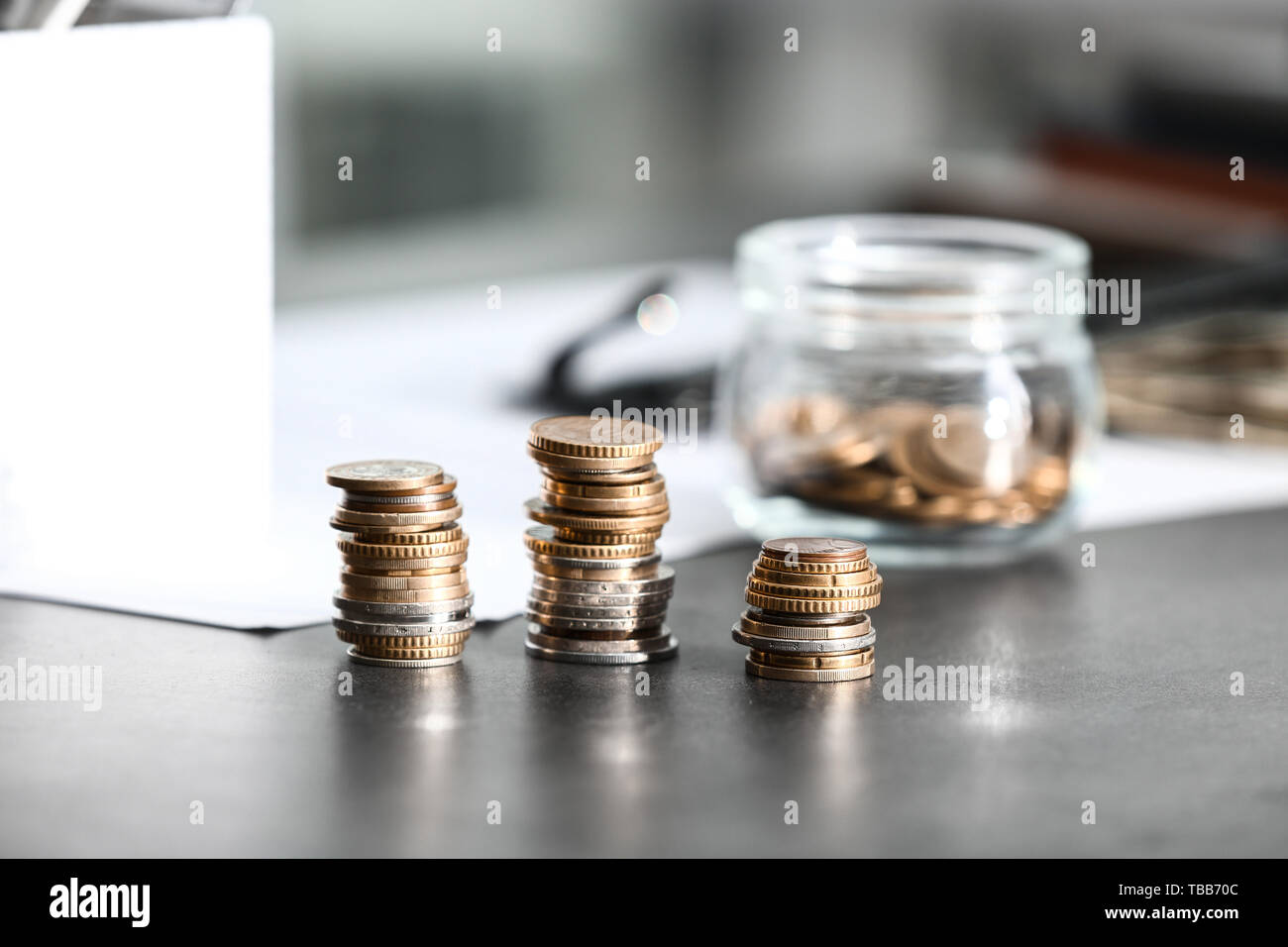 Stacked coins on table. Concept of planning budget Stock Photo - Alamy