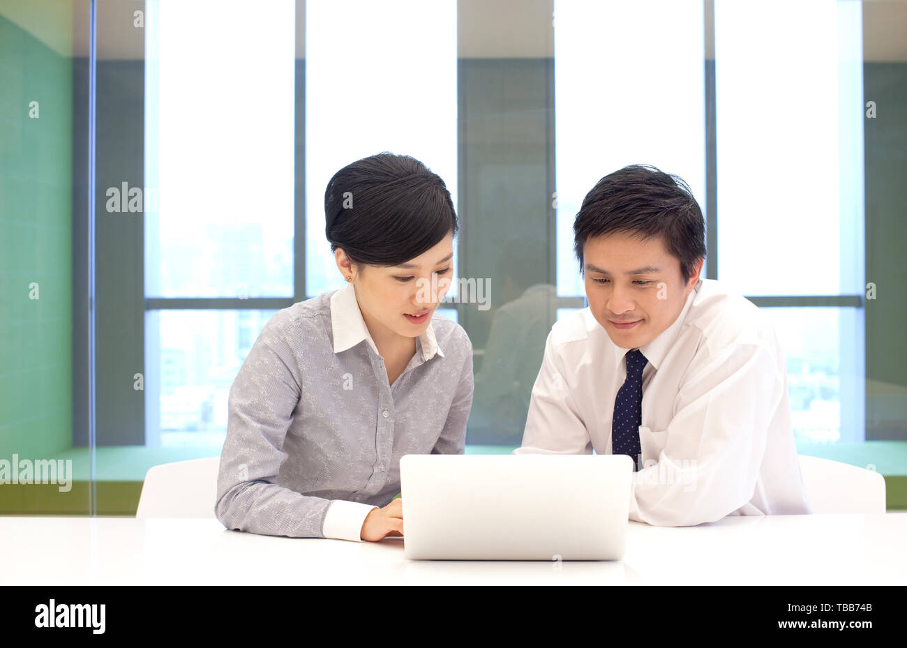 Communication between two business people at work Stock Photo - Alamy