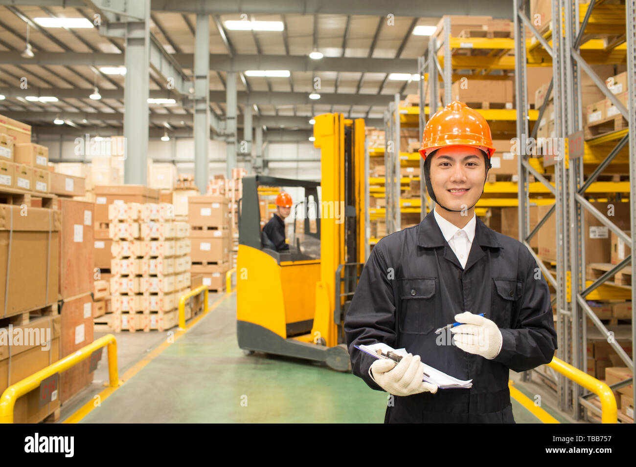Logistics personnel load and unload cargo at the warehouse Stock Photo ...