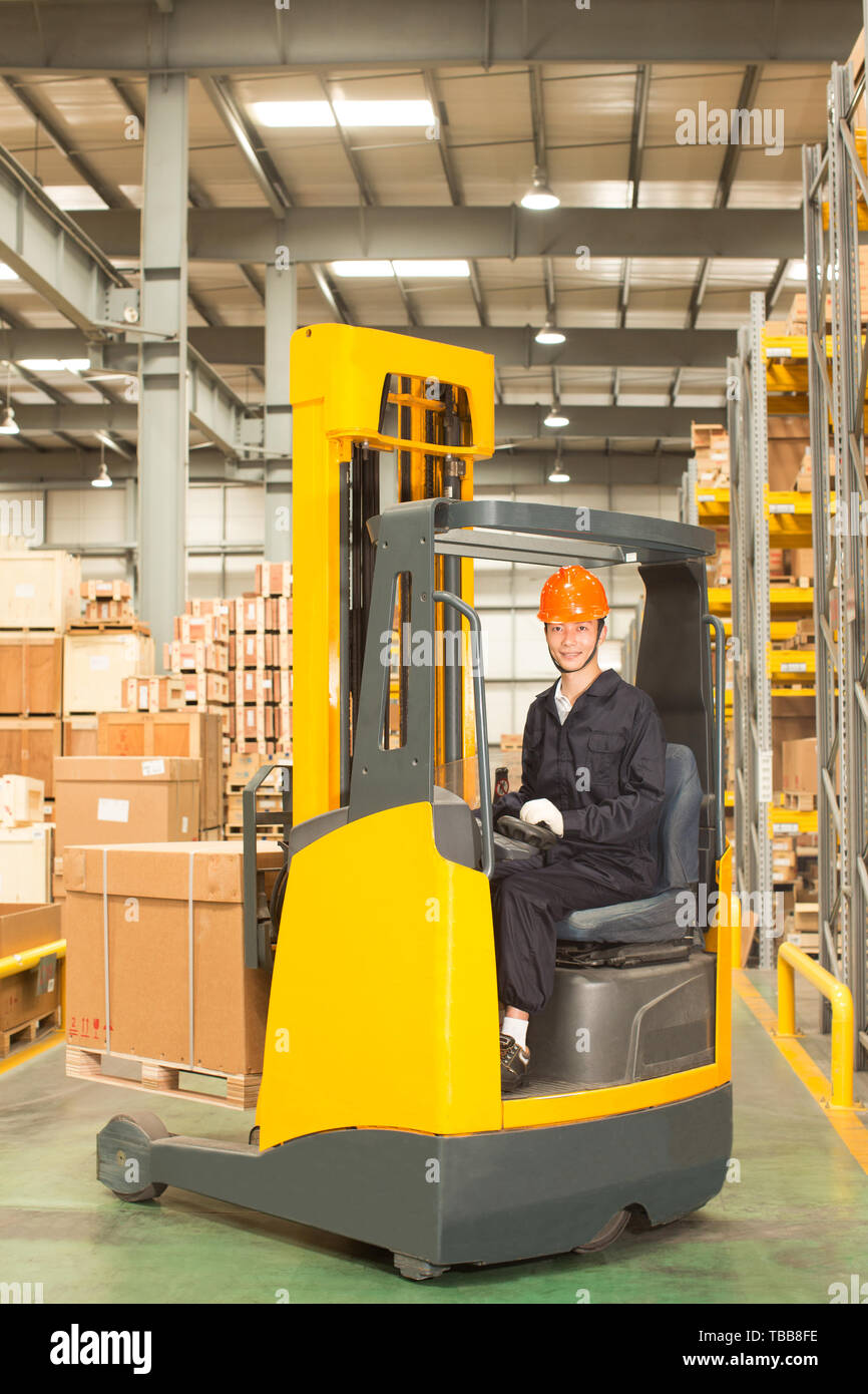 Logistics personnel load and unload cargo at the warehouse Stock Photo ...