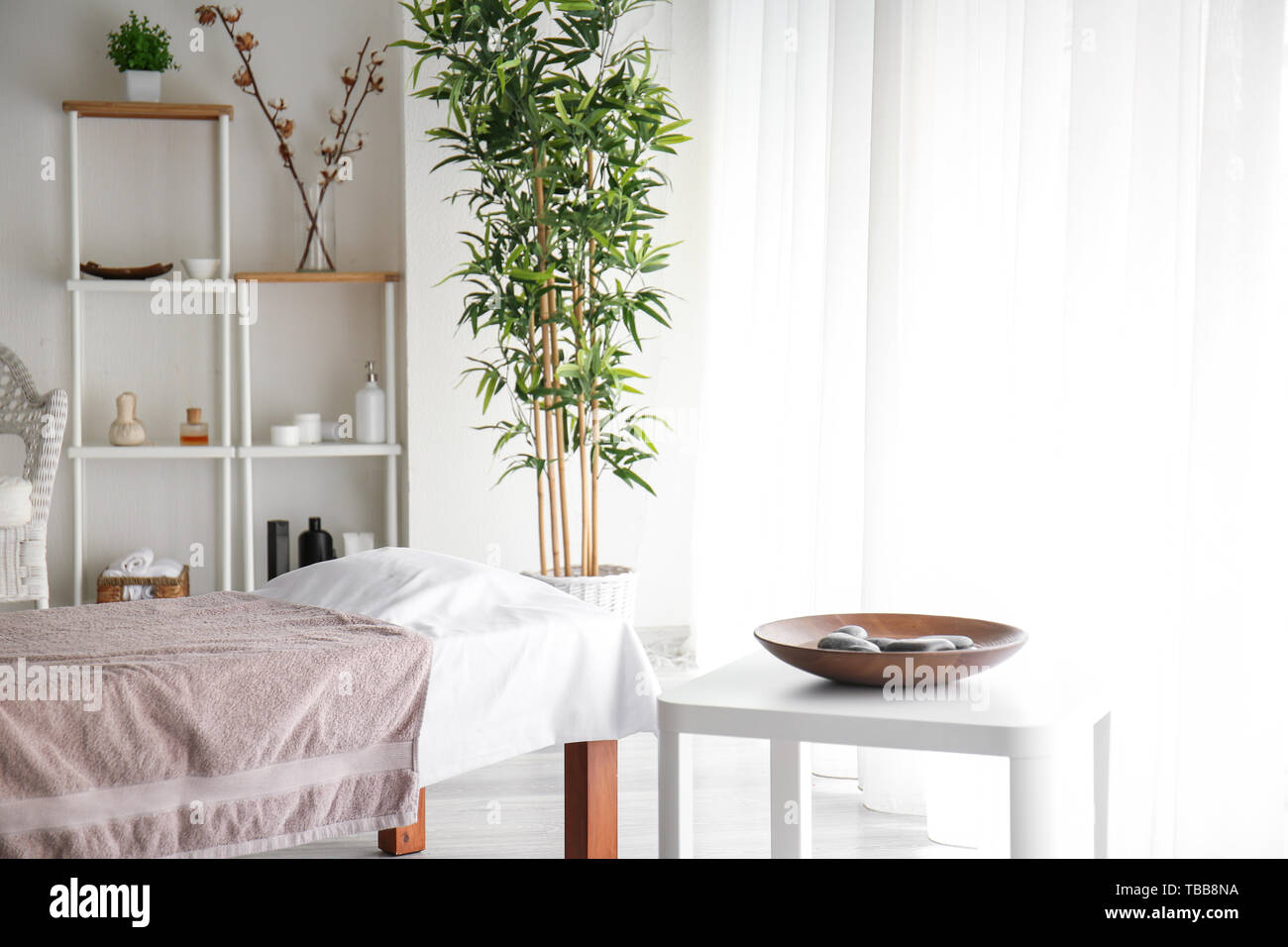 Interior of massage room in modern spa salon Stock Photo - Alamy
