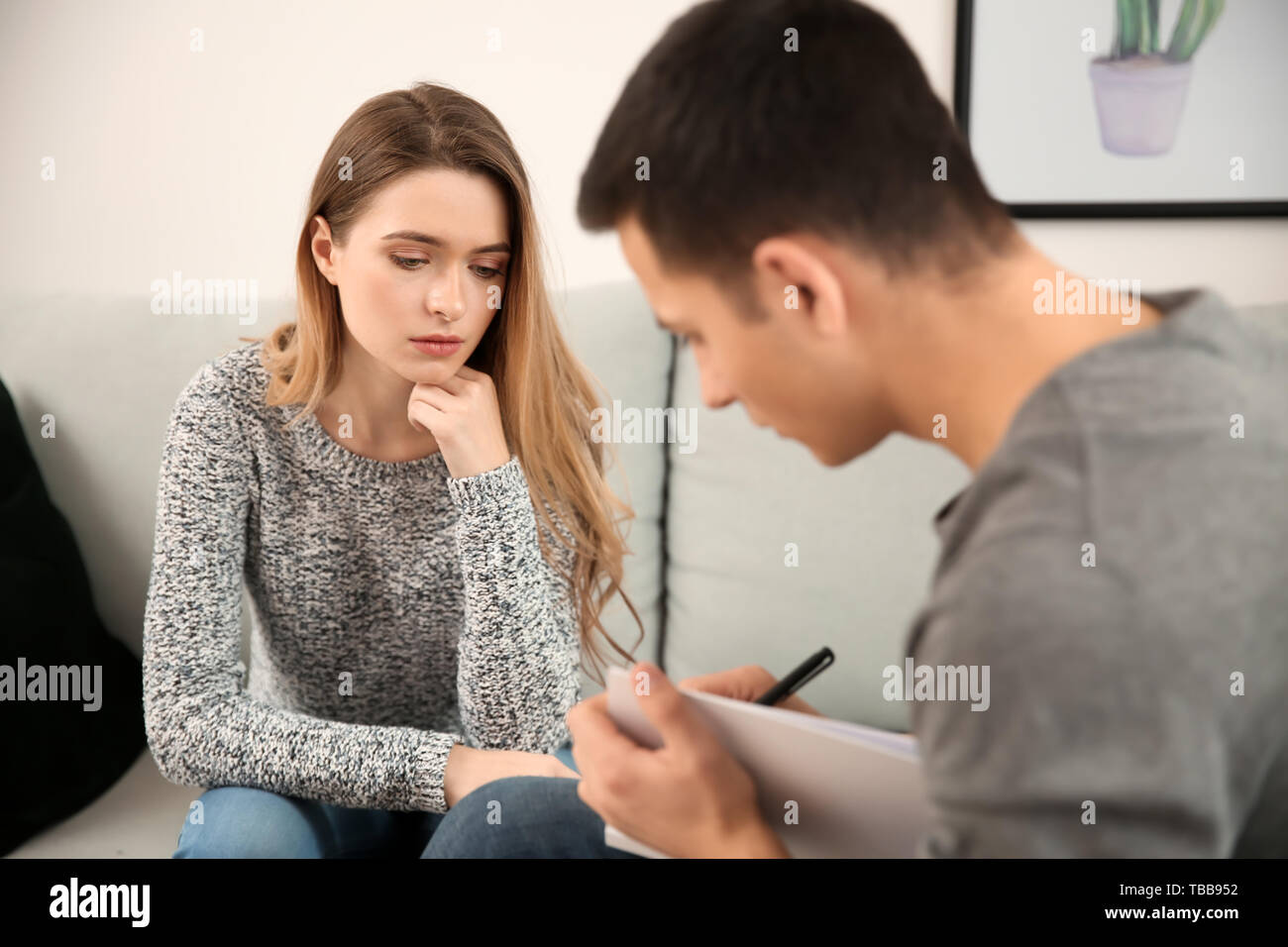 Male psychologist working with patient in office Stock Photo - Alamy