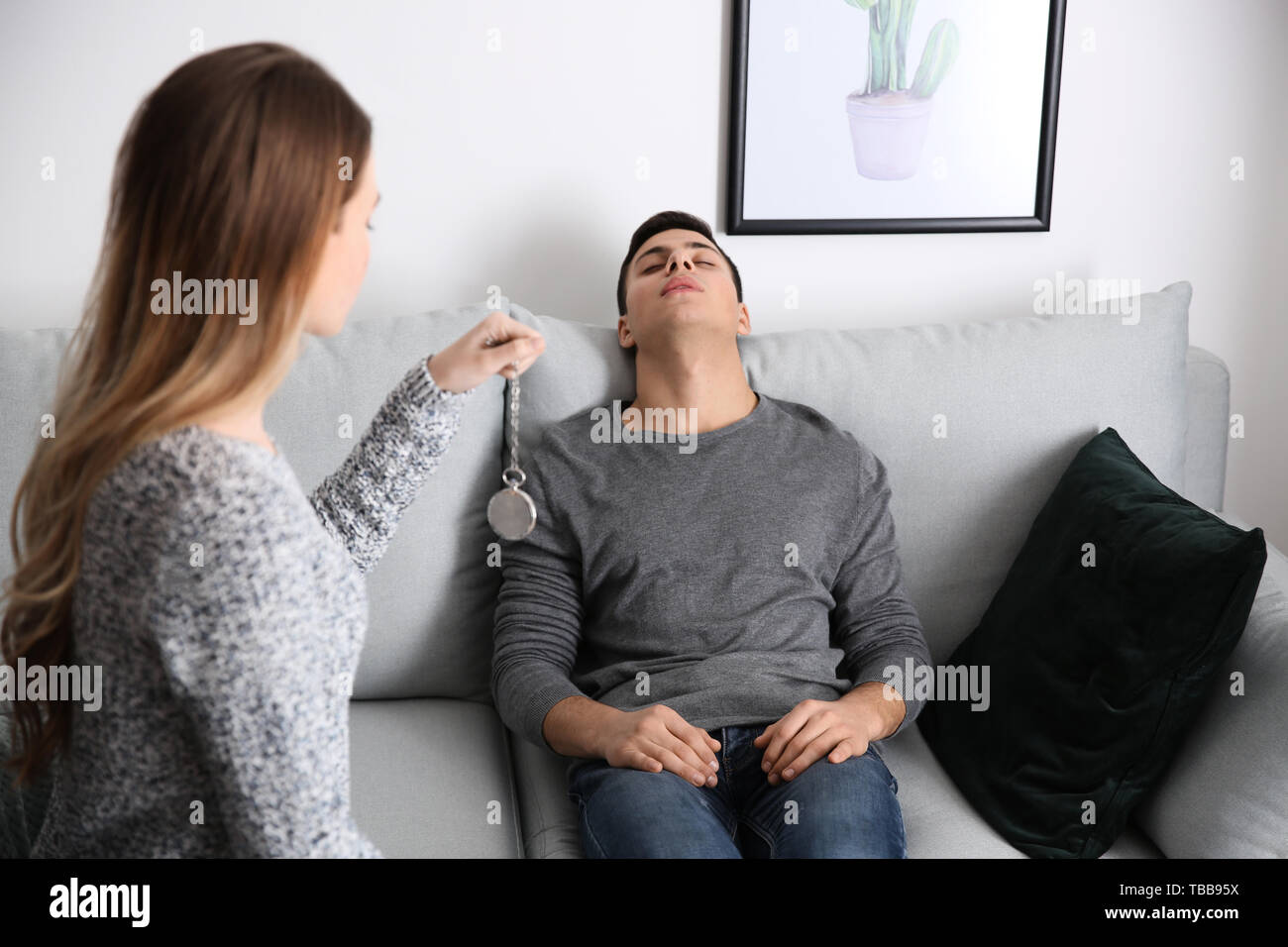Medicine hypnosis man hypnotizing woman hi-res stock photography and ...