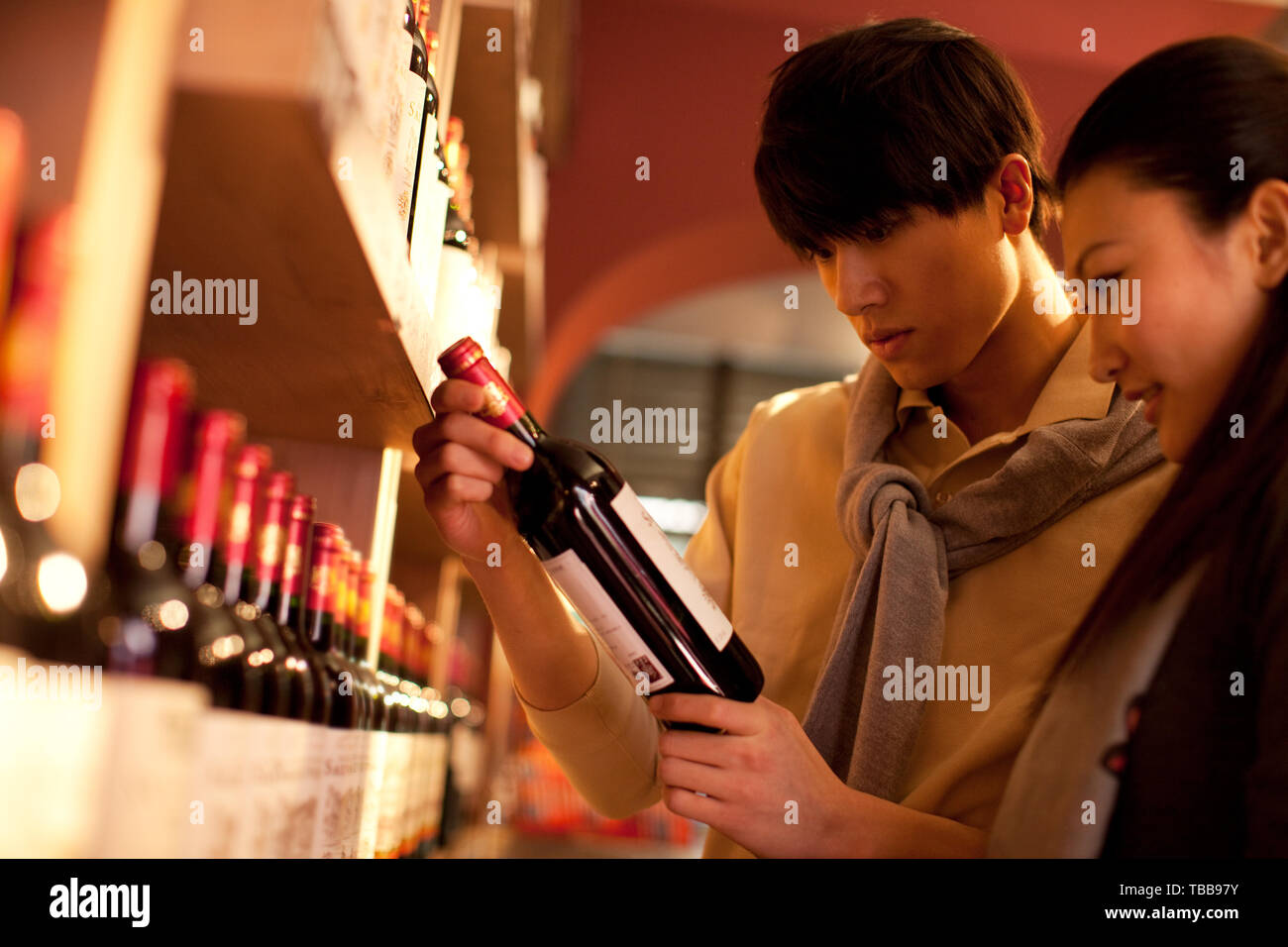 Man woman share bottle red hi-res stock photography and images - Alamy
