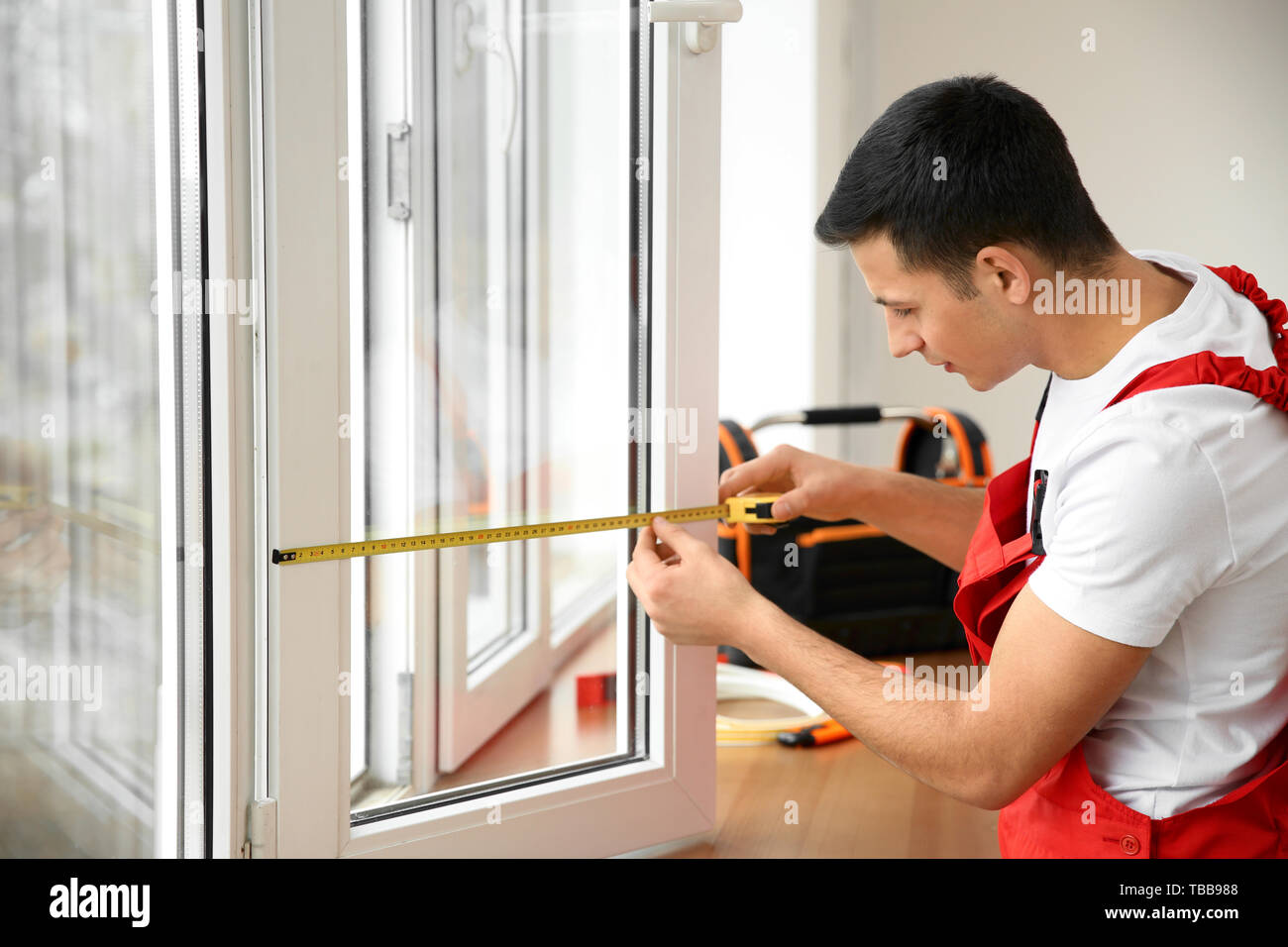 Worker man taking measurements hi-res stock photography and images - Alamy