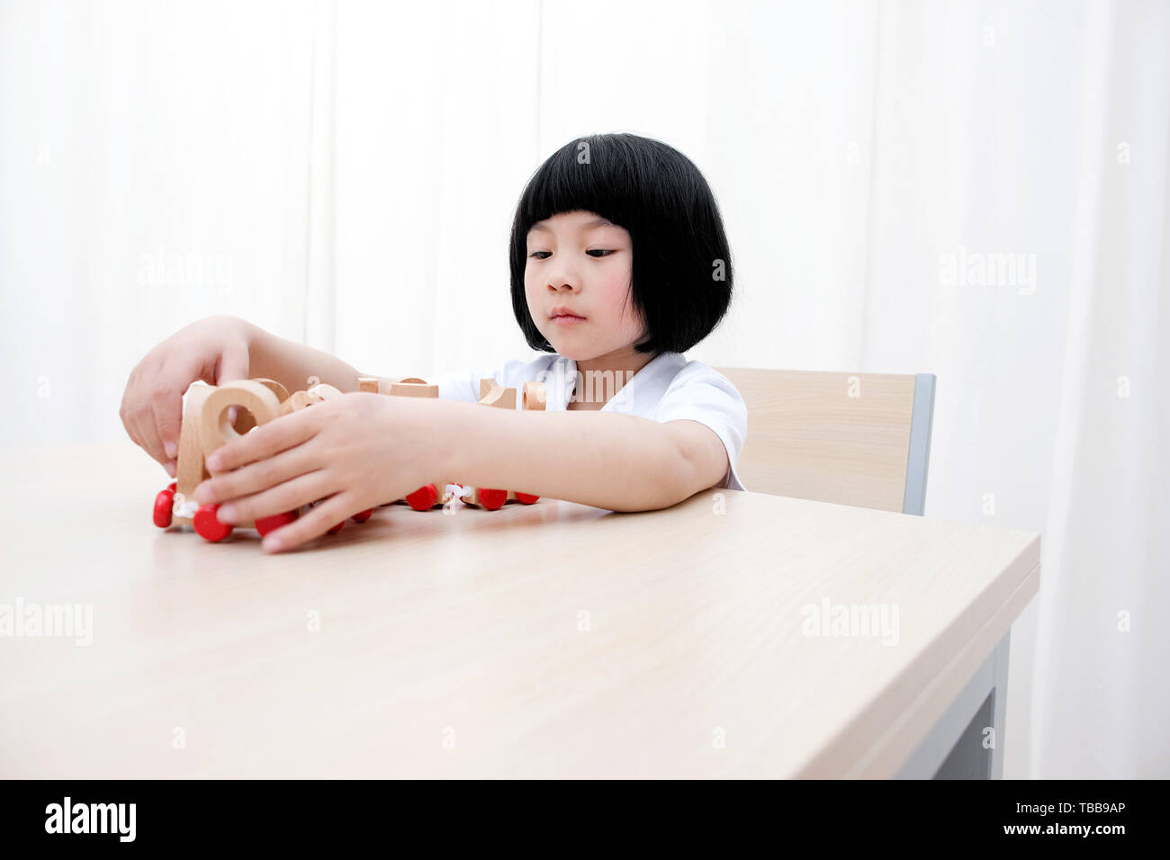 A child acquires knowledge in a game Stock Photo - Alamy