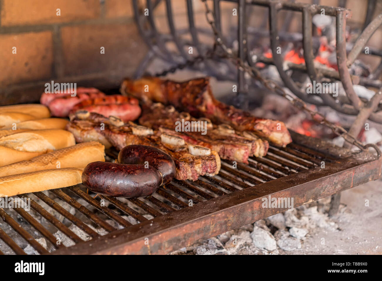 "Parrillada" Argentine barbecue make on live coal (no flame), beef "asado", bread, "Chorizo" and ...