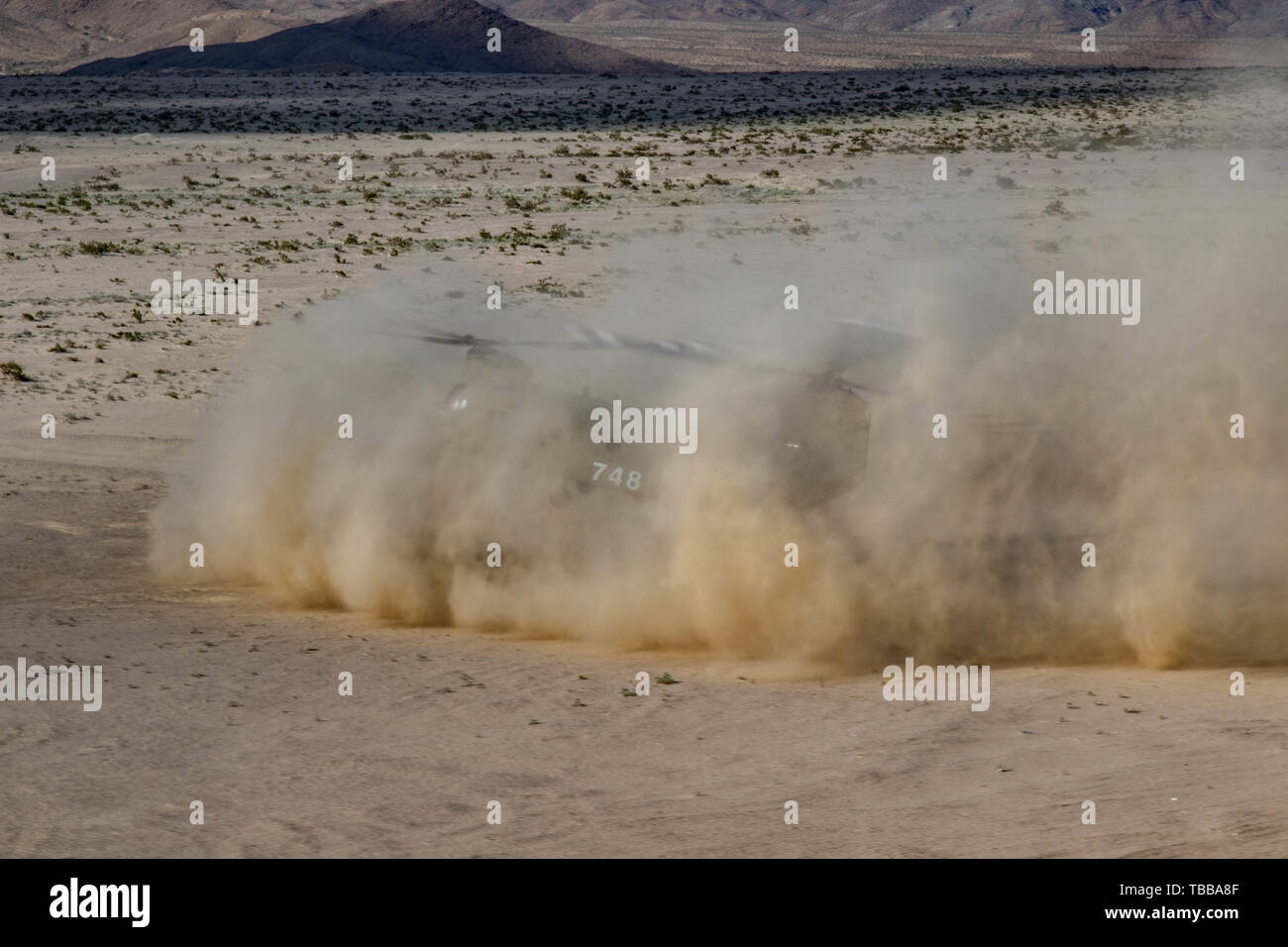 A CH-47F Chinook surrounded by a cloud of dust as Oregon Army National ...