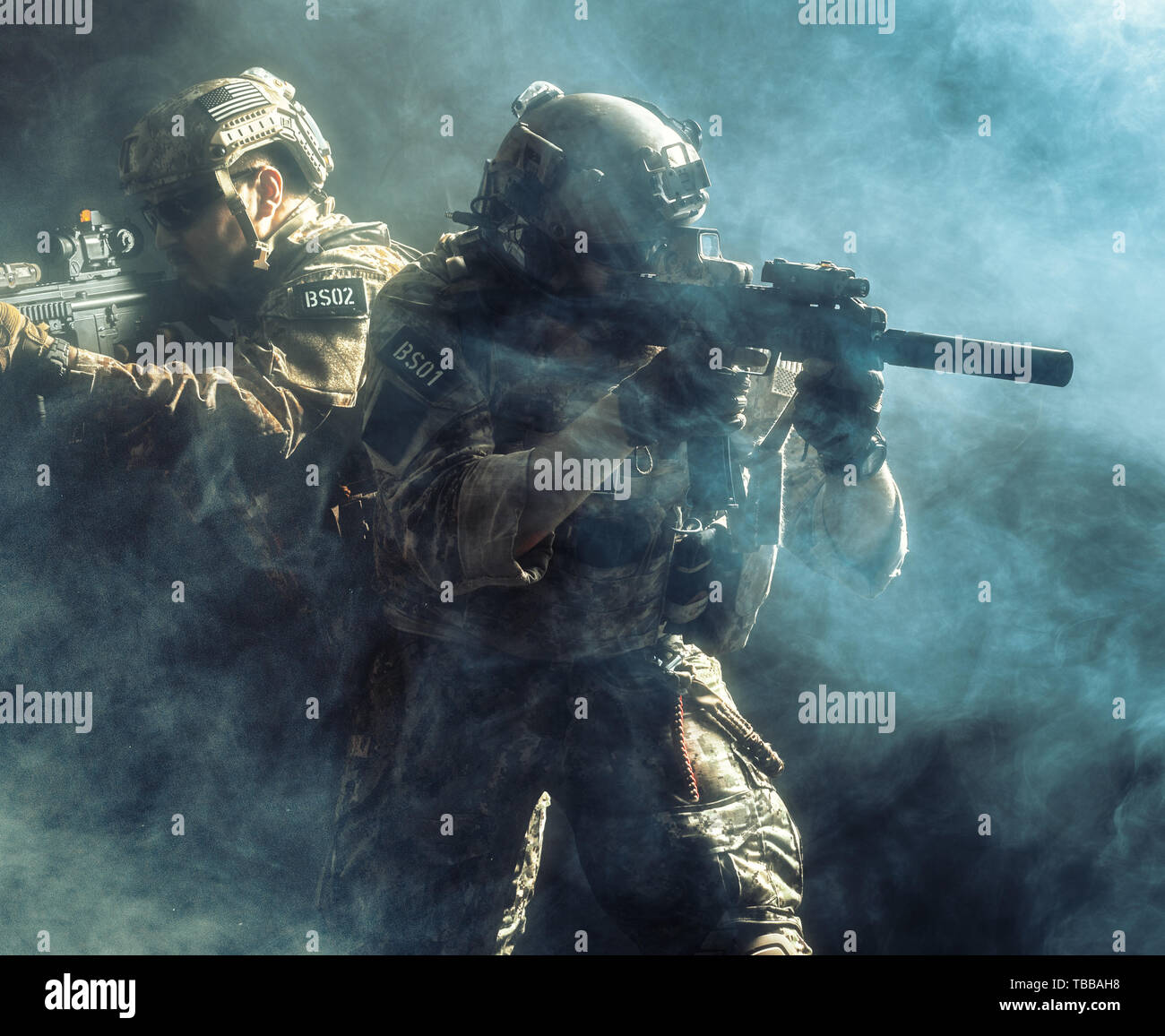 Group of security forces in Combat Uniforms with rifles Stock Photo - Alamy