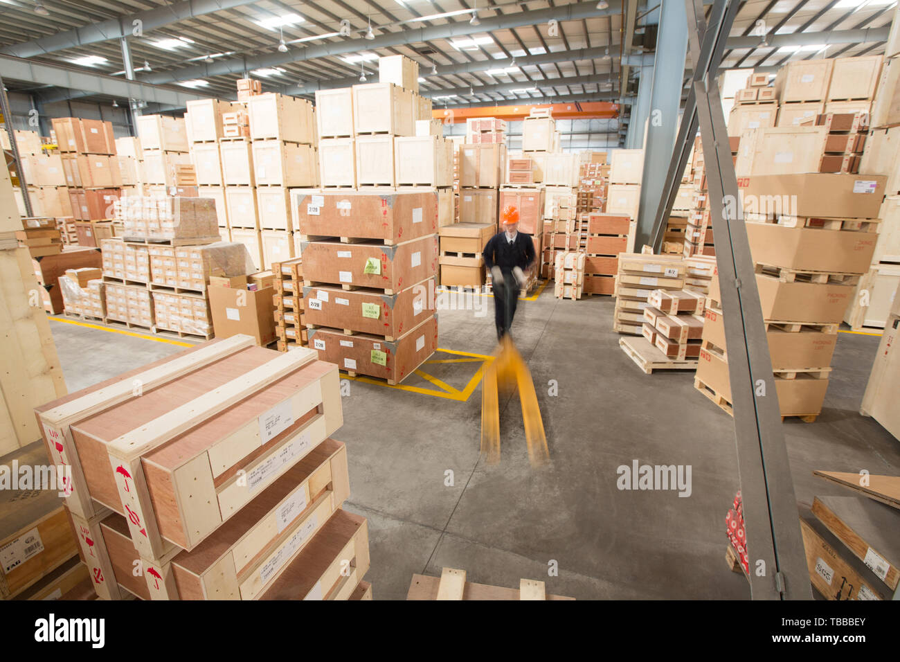 Logistics personnel load and unload cargo at the warehouse Stock Photo ...