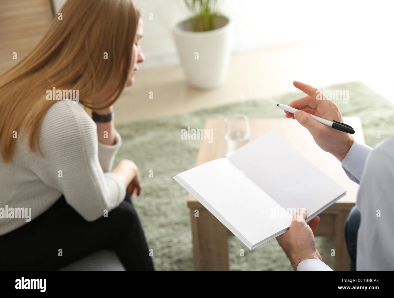 Male psychologist working with patient in office Stock Photo - Alamy
