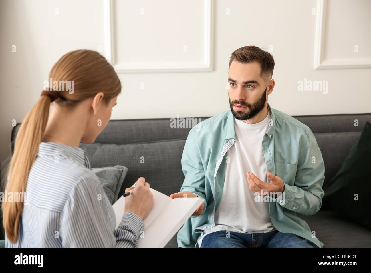 Female psychologist working with patient in office Stock Photo - Alamy