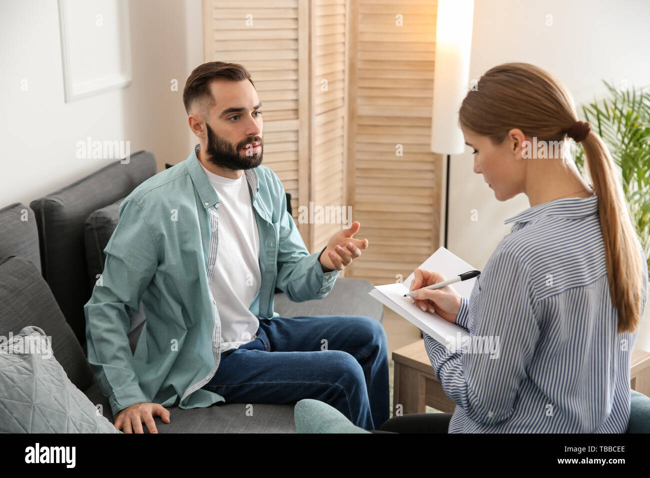 Female psychologist working with patient in office Stock Photo - Alamy