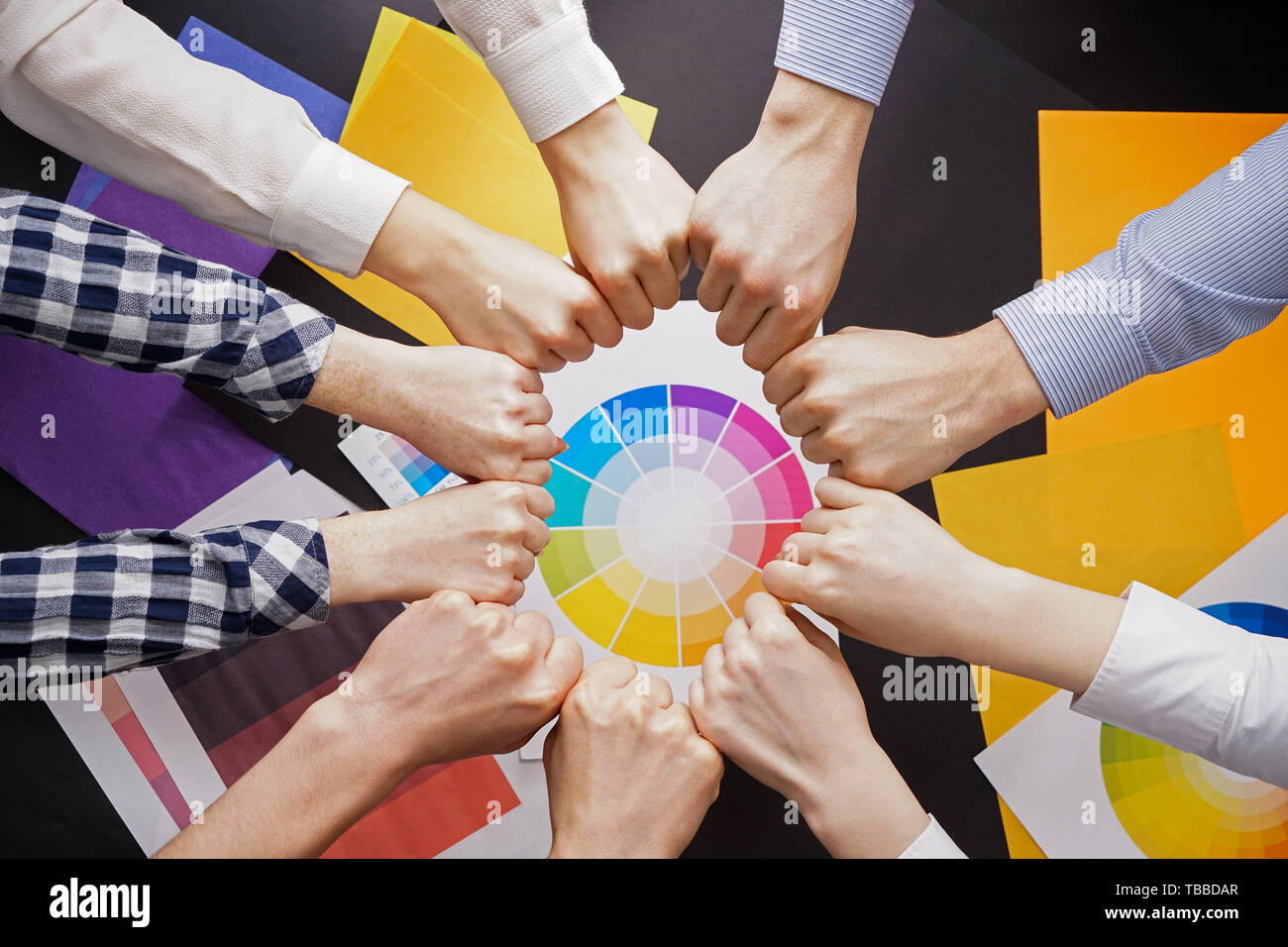 Group of people holding hands together in office. Concept of unity ...