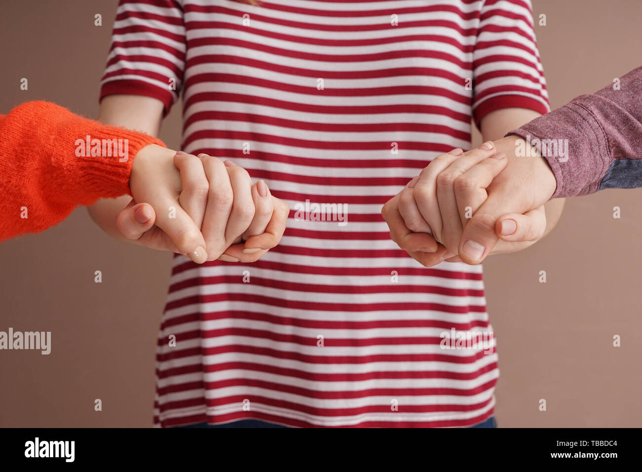 Group of people holding hands together. Concept of unity Stock Photo ...