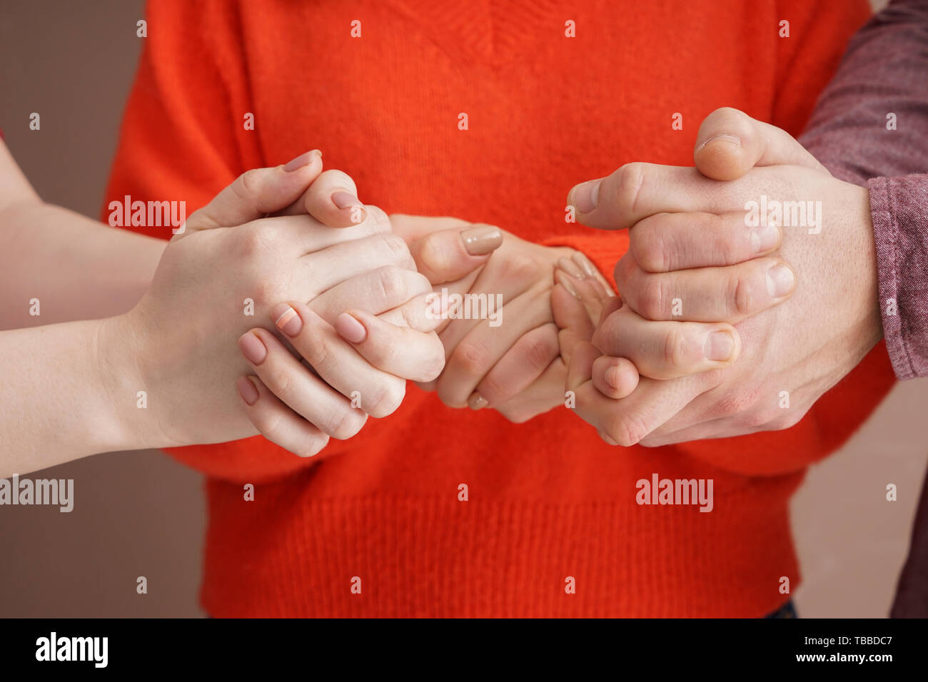 Group of people holding hands together. Concept of unity Stock Photo ...