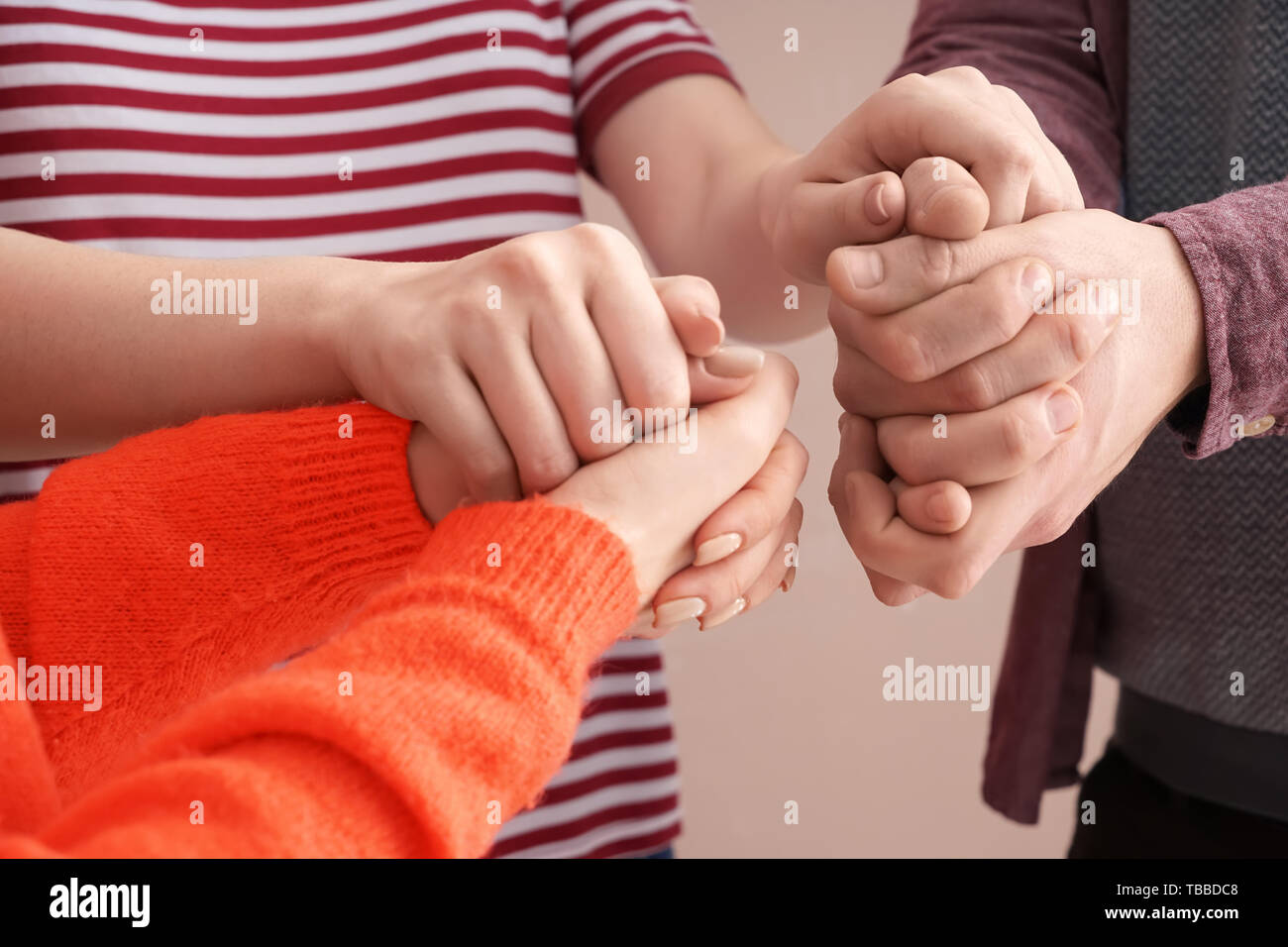 Group of people holding hands together. Concept of unity Stock Photo ...