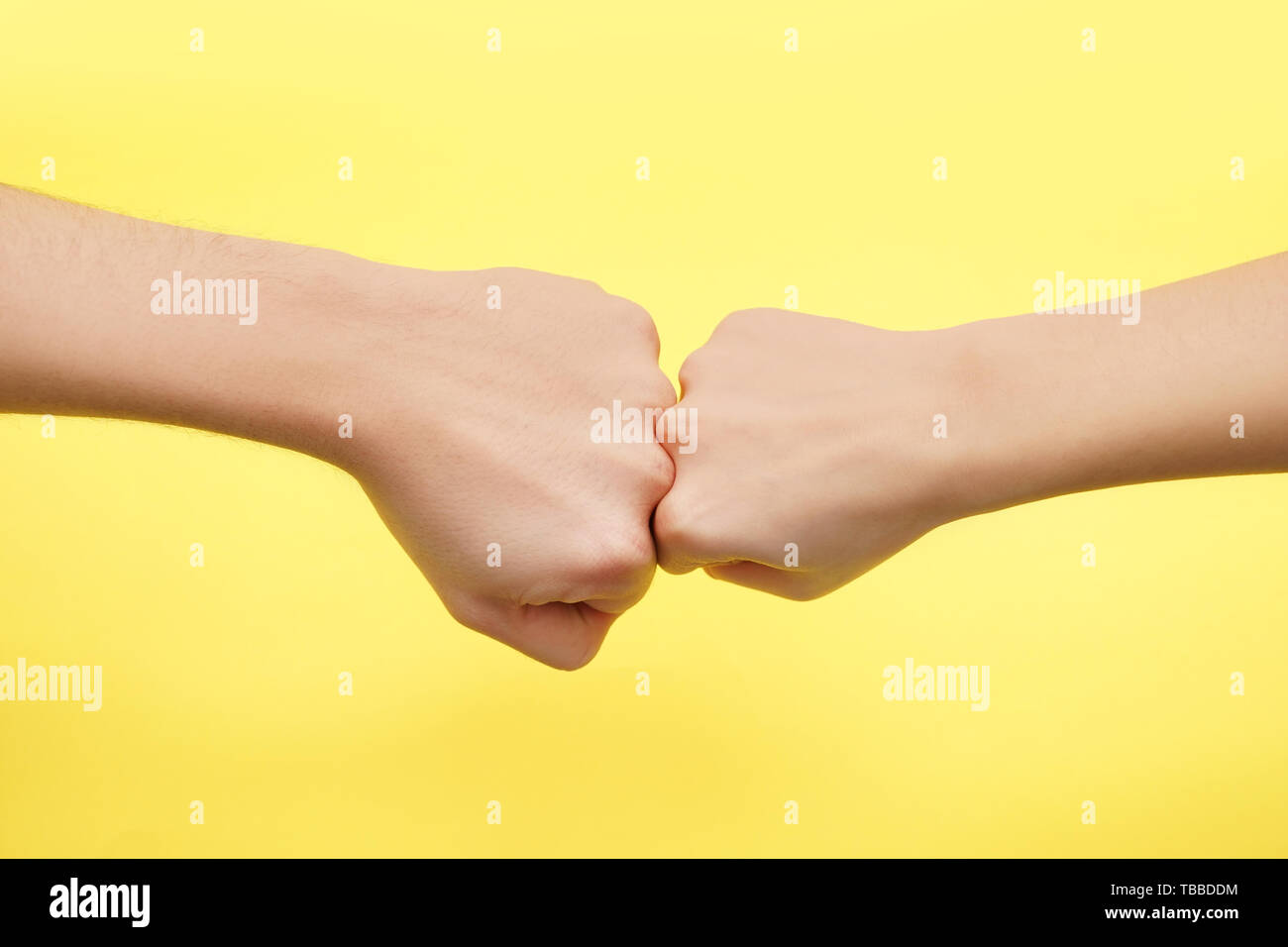 Two hands bumping fists hi-res stock photography and images - Alamy