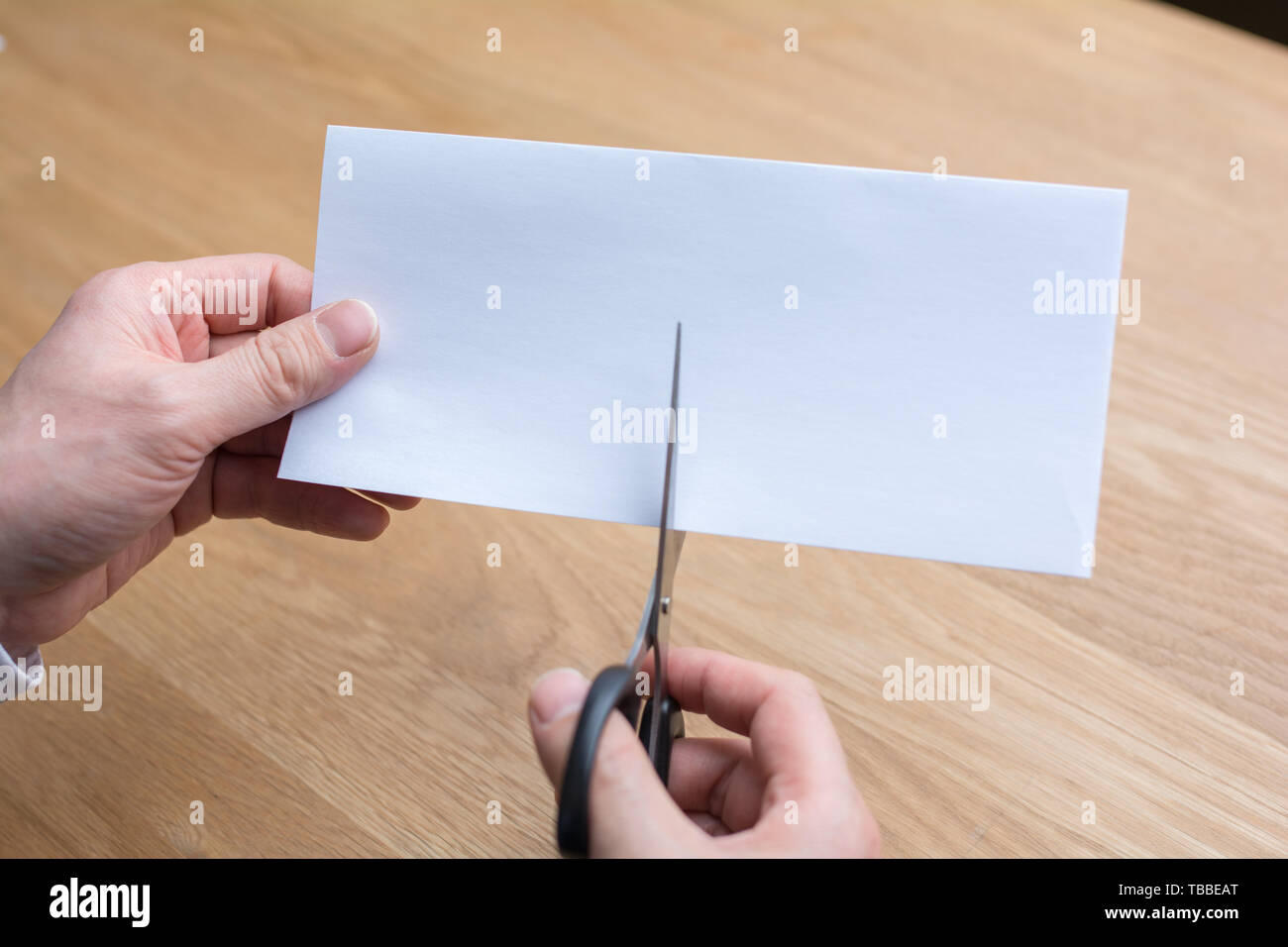 Topping cutting paper by scissors Stock Photo - Alamy