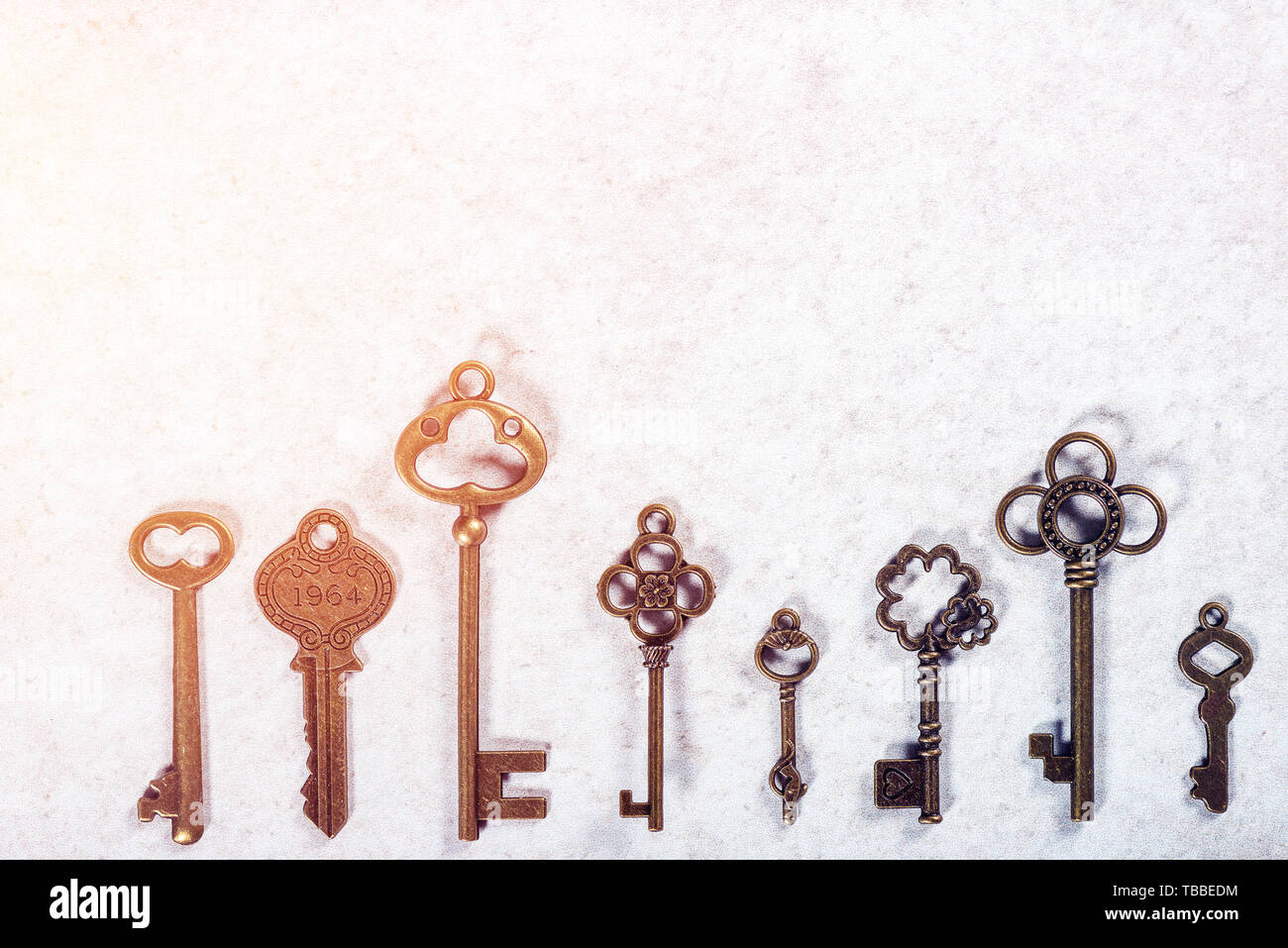Decorative keys of different sizes and styles on grey background Stock ...
