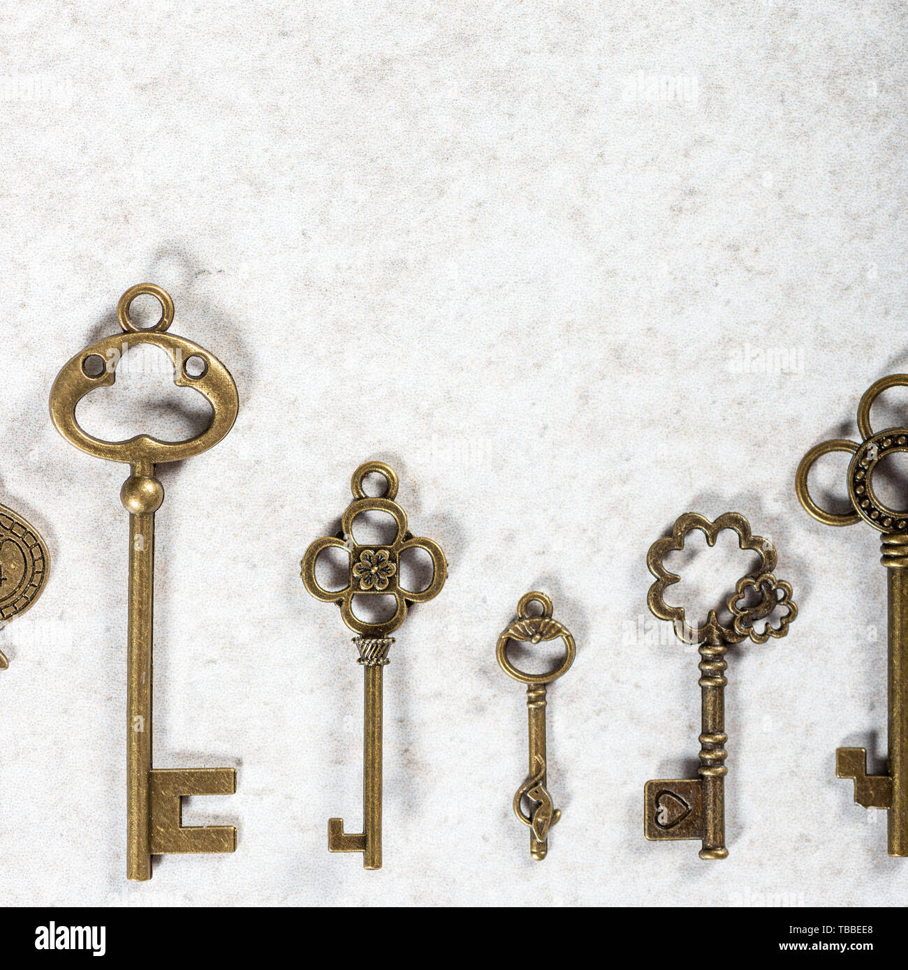 Decorative keys of different sizes and styles on grey background Stock ...