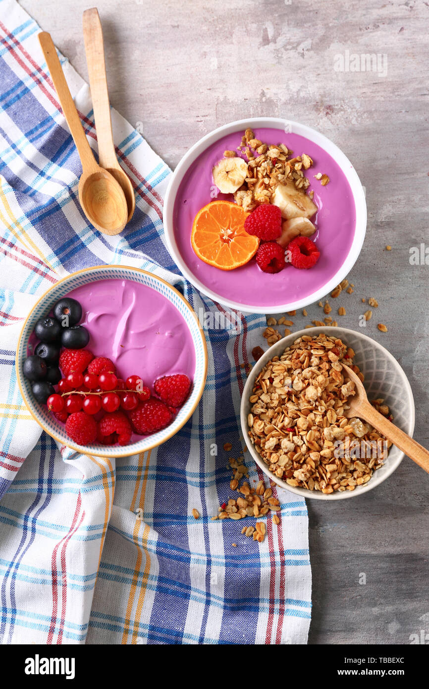 Composition with tasty acai smoothie bowls on table Stock Photo - Alamy