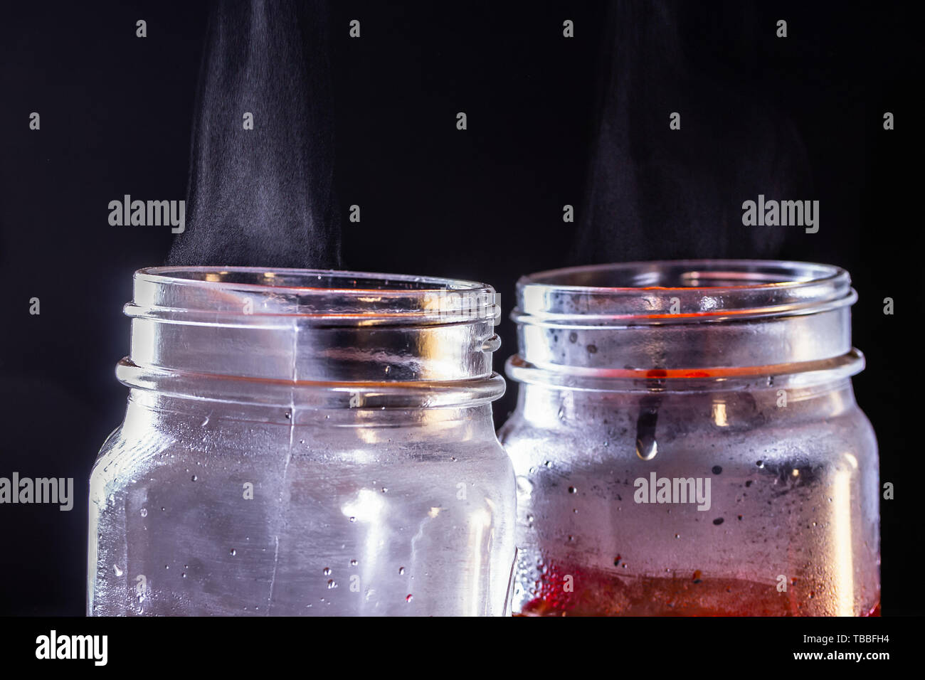 Steam rises from cocktail cans covered with condensate due to ...
