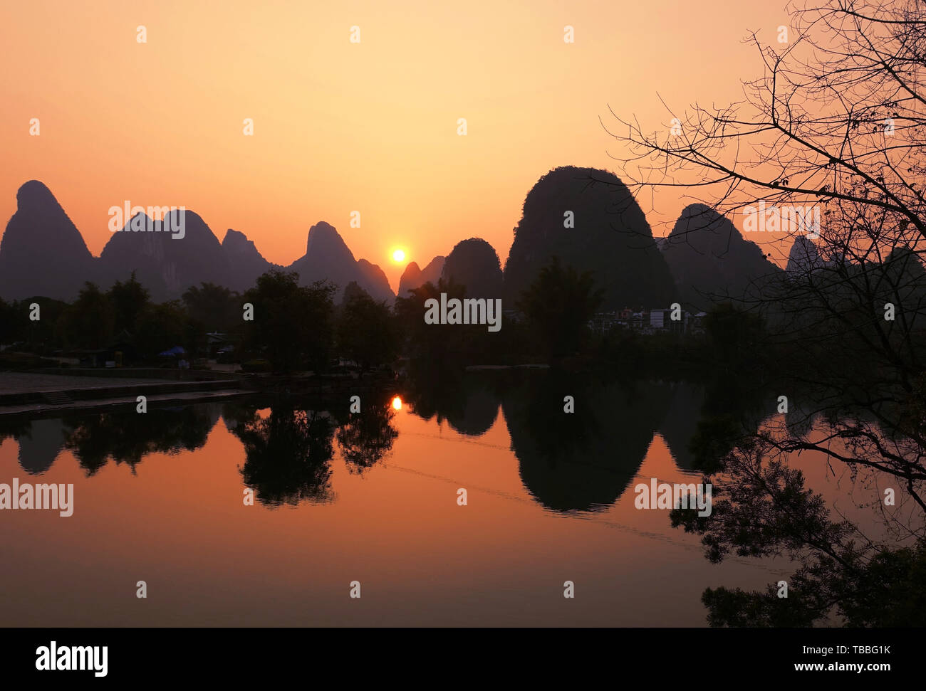 The beauty of the sunset lake view and karst landform Stock Photo - Alamy