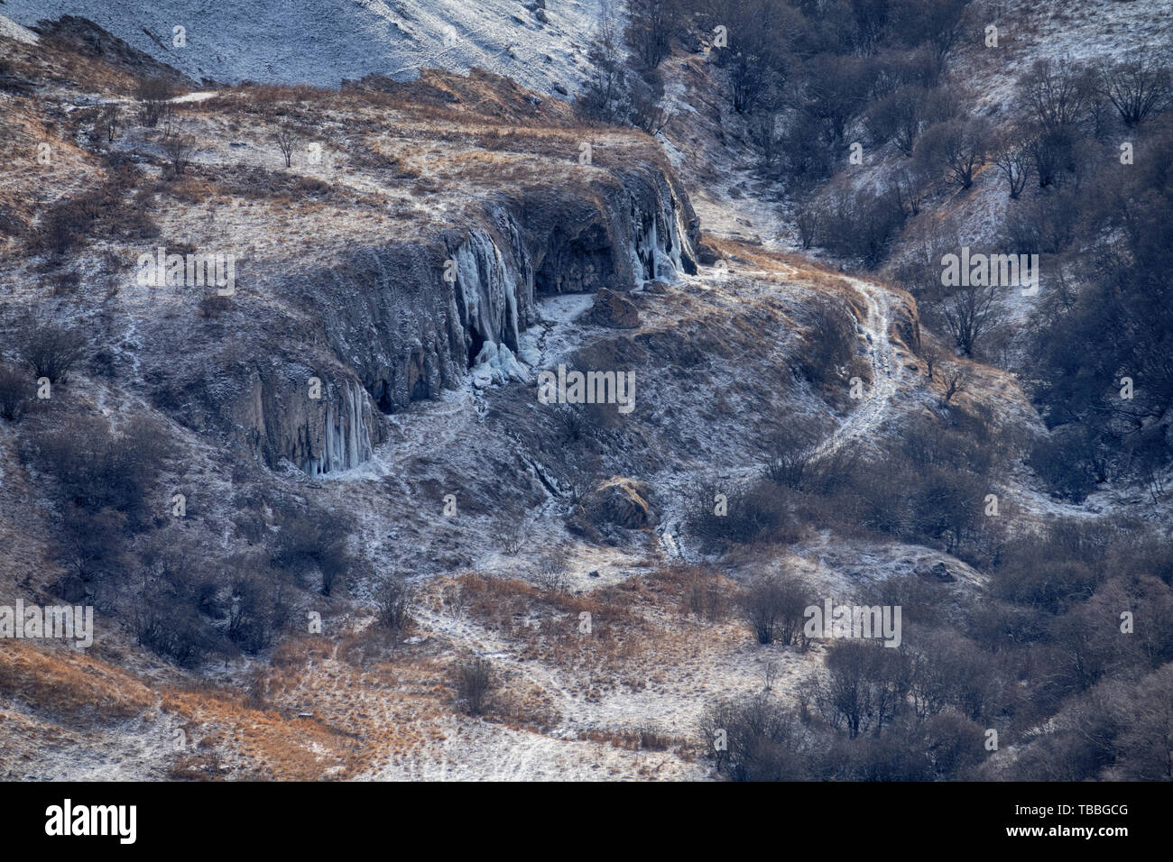 Ravine, erosion gully with terraces, shrubs, streams and frozen ...