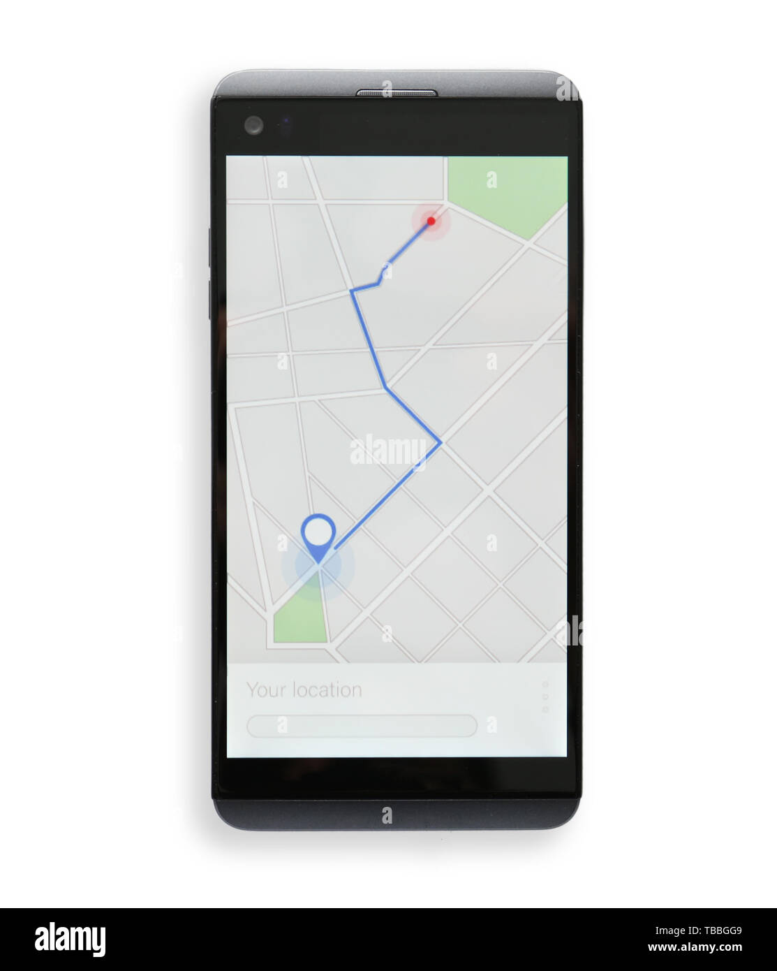 Mobile phone displaying map with route on screen against white ...