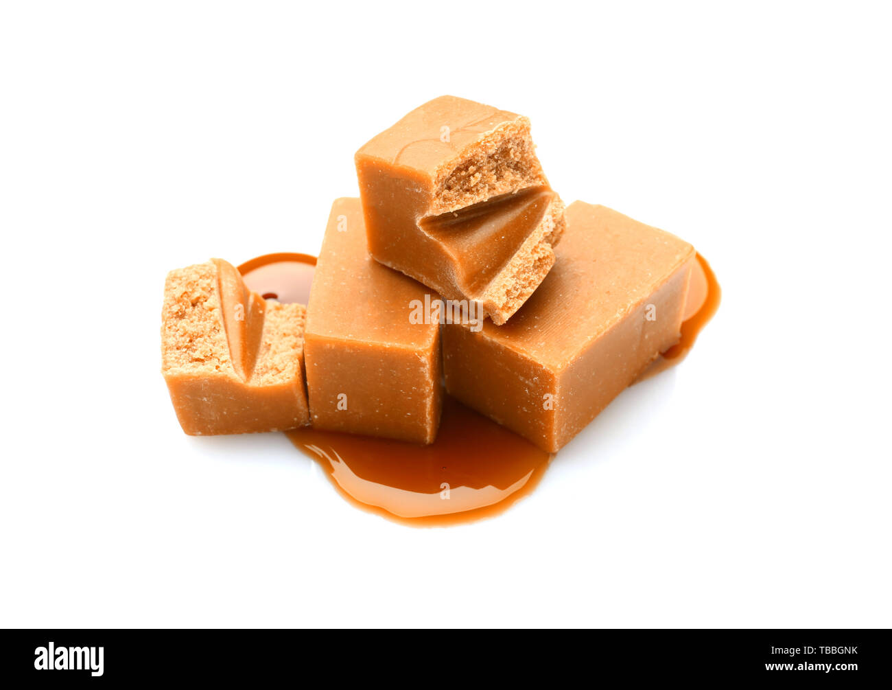 Tasty sweet caramel on white background Stock Photo - Alamy