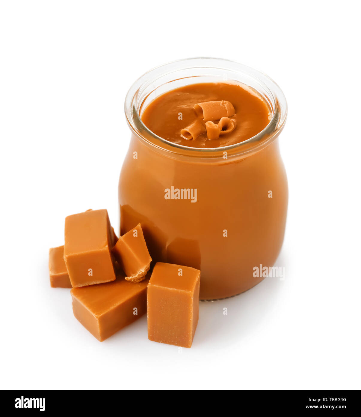 Jar with sweet liquid caramel on white background Stock Photo - Alamy