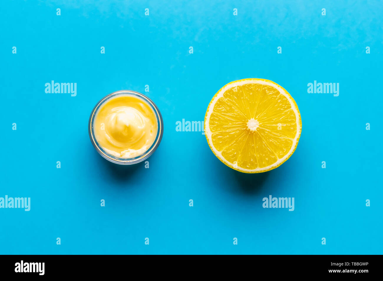 Face cream and orange on a bright blue background. Cosmetics from ...