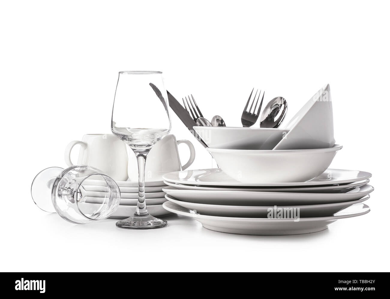 Set of clean dishes on white background Stock Photo - Alamy