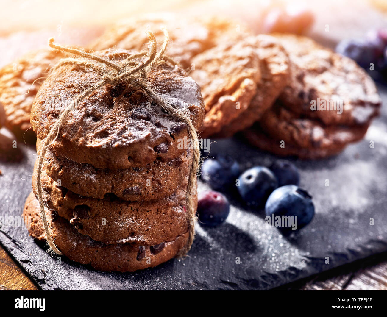 Chocolate chip cookies tied with string. Serving food on slate Stock ...