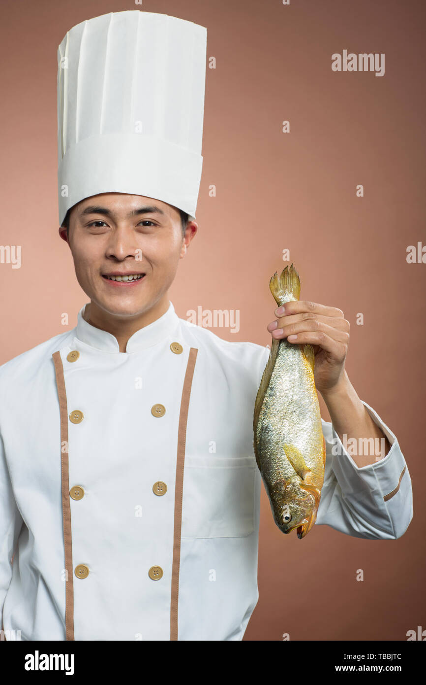 Chinese man cook fish hi-res stock photography and images - Alamy