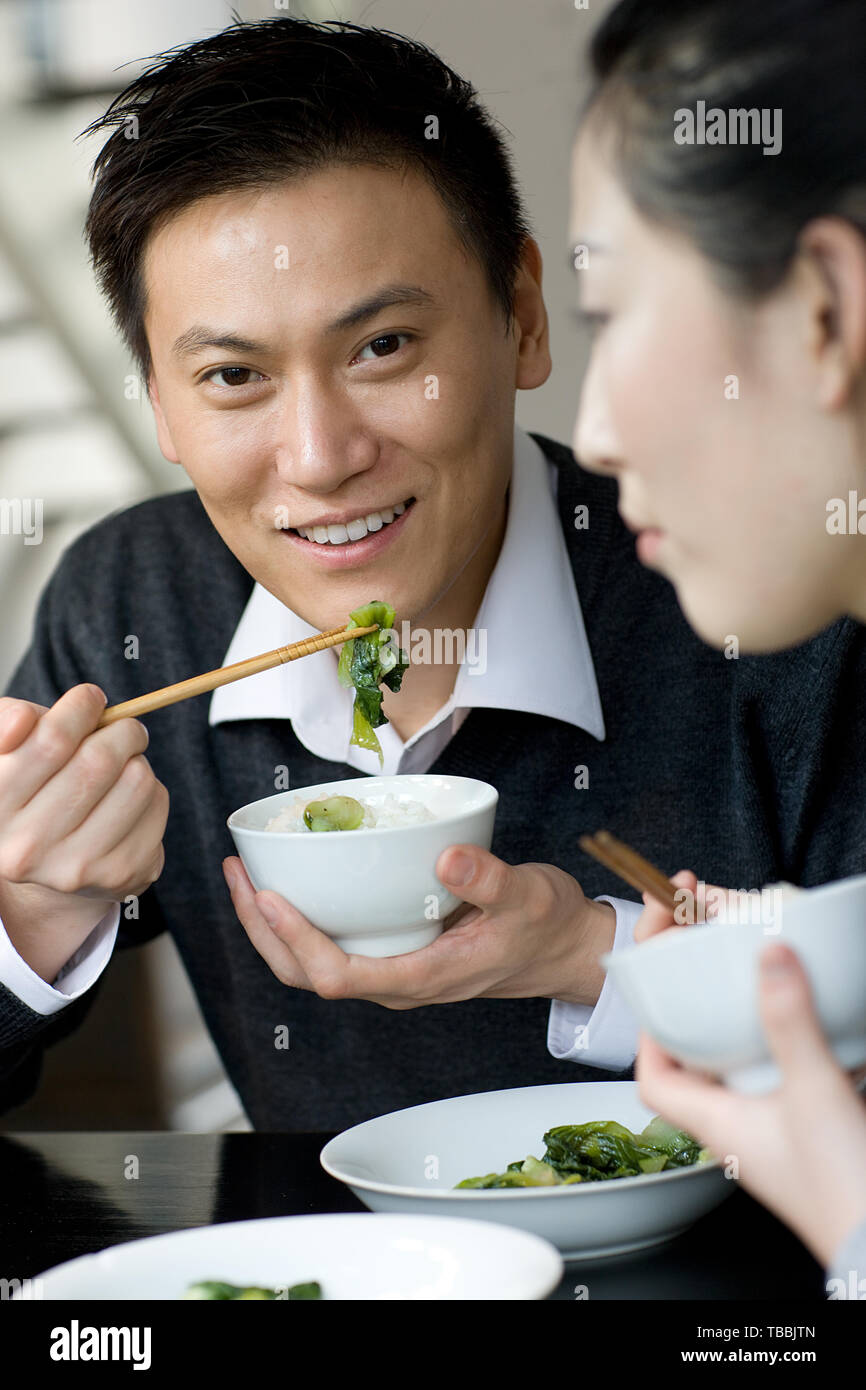 Smiling chinese couple facing hi-res stock photography and images - Alamy