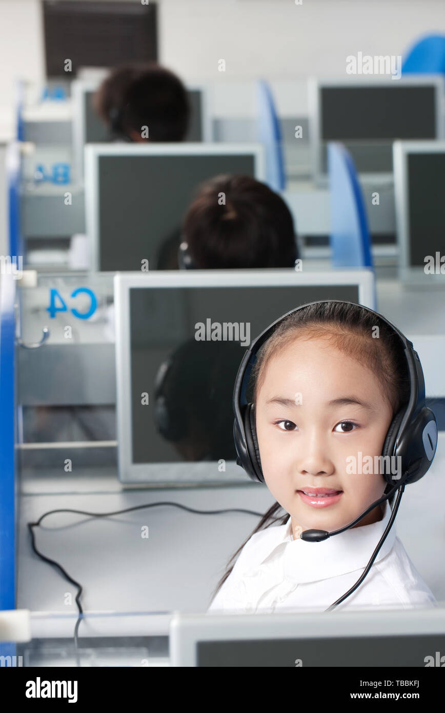 Three primary school students are in class in the classroom Stock Photo ...