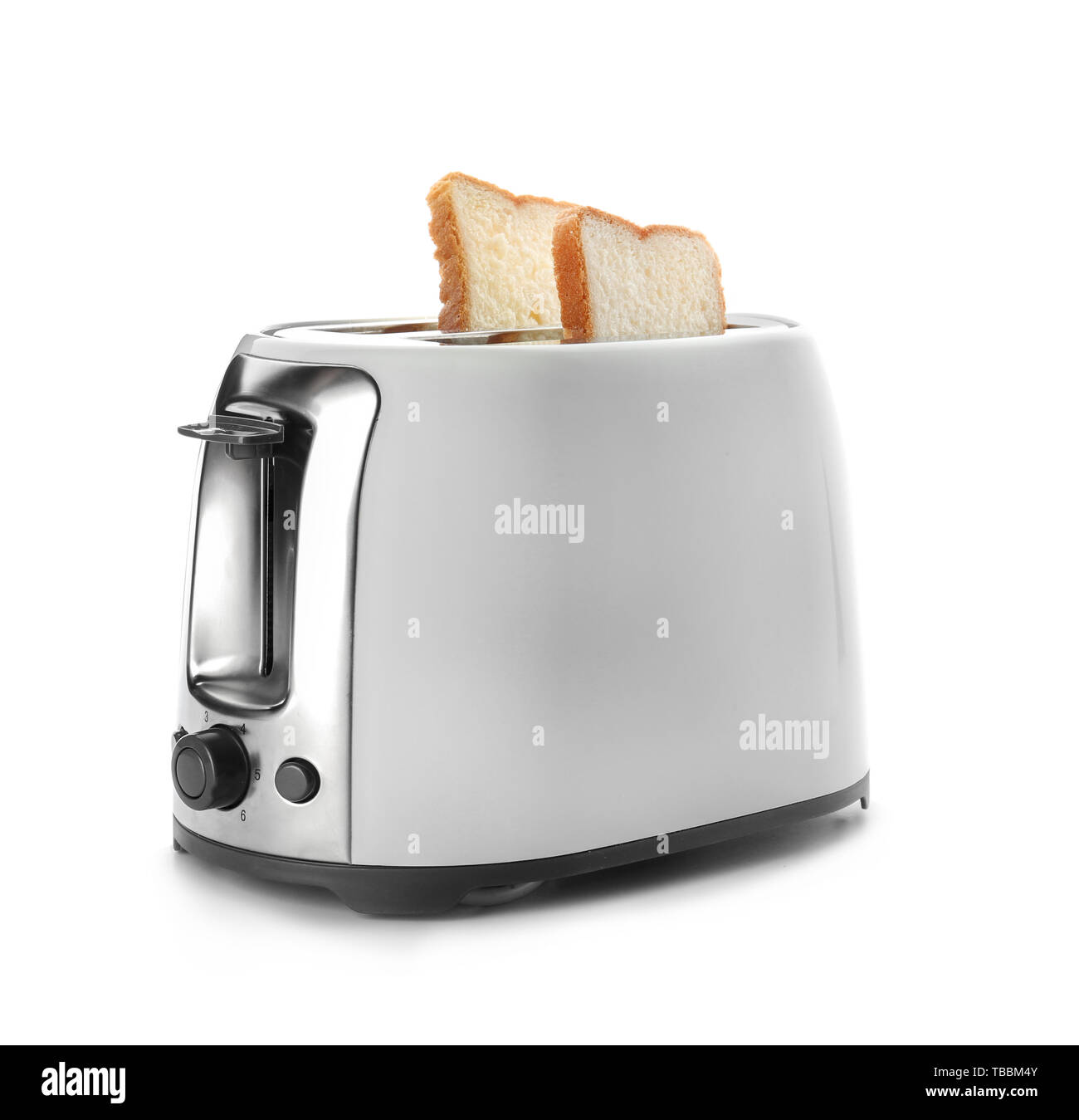 Toaster with bread slices on white background Stock Photo - Alamy