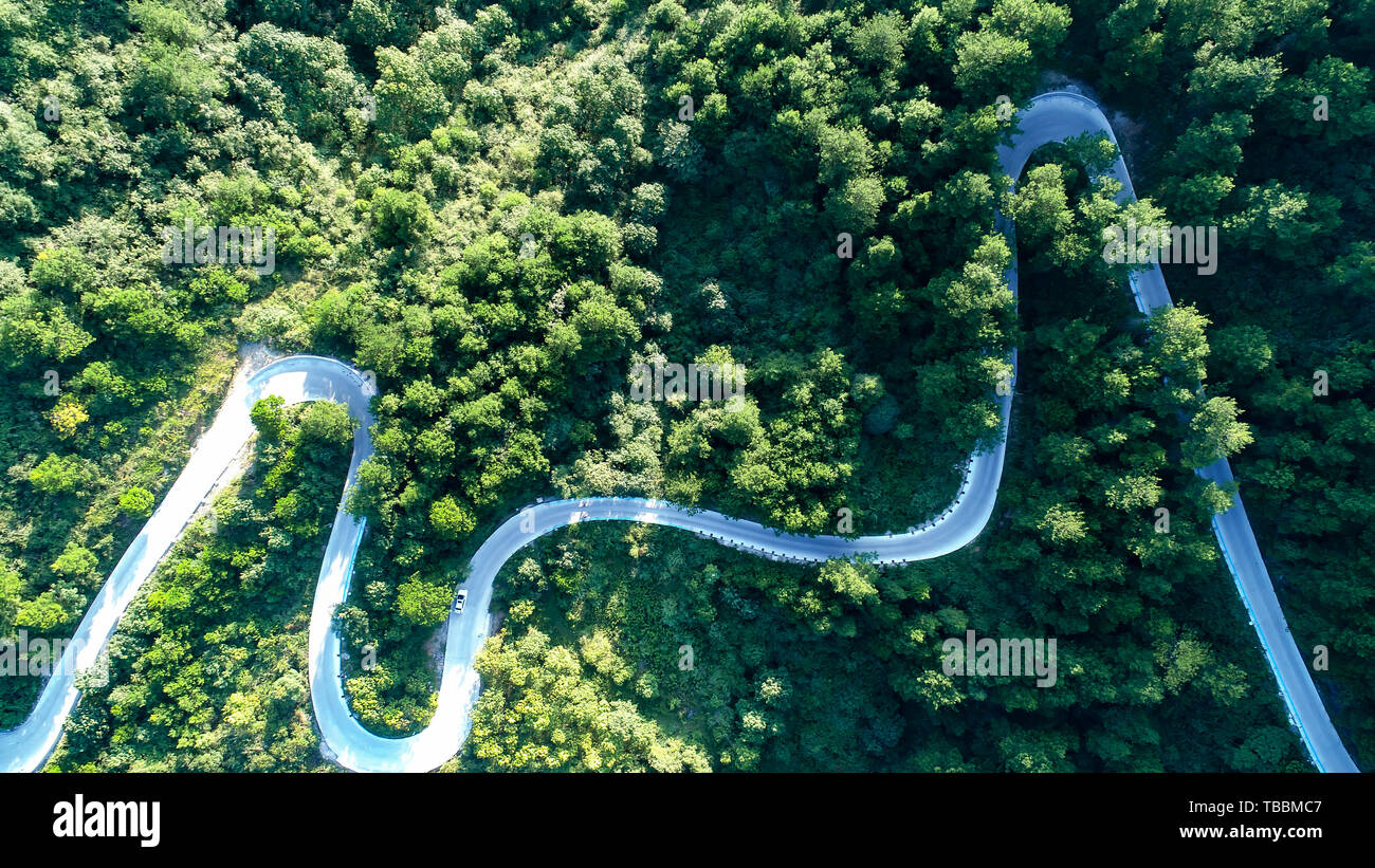 The curved Panshan road lies in the jungle like a dragon Stock Photo ...