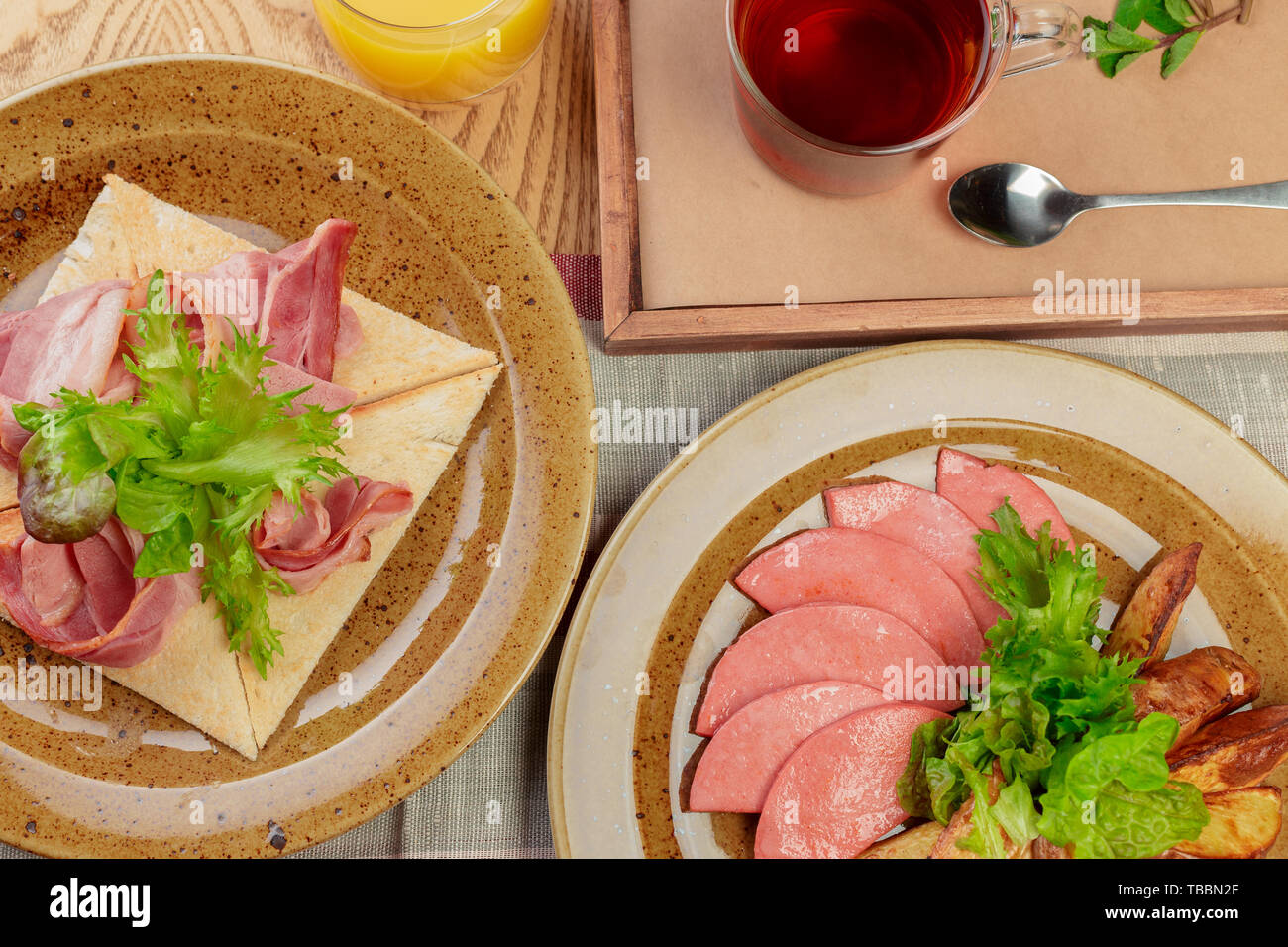 Russian pancake with ham slices close up Stock Photo - Alamy