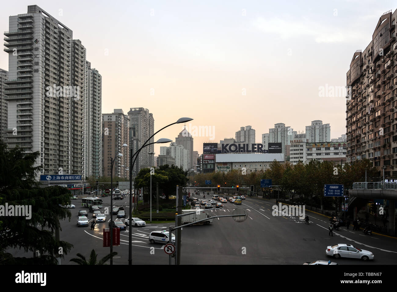 Street Scene in Shanghai on Evening with Houses an Cars Stock Photo - Alamy