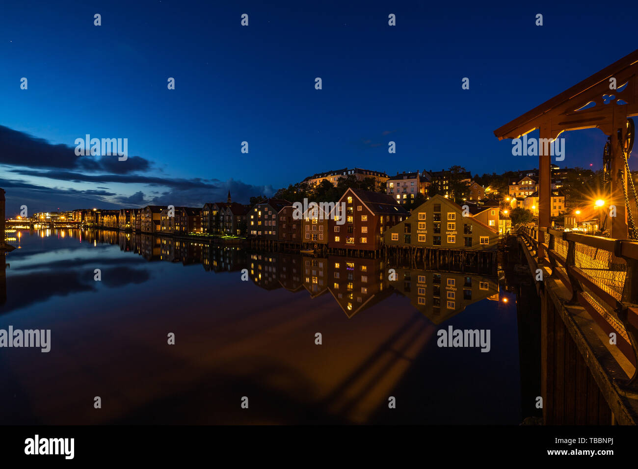 Typical old timber buildings on Nidelva River viewed from Old Town ...
